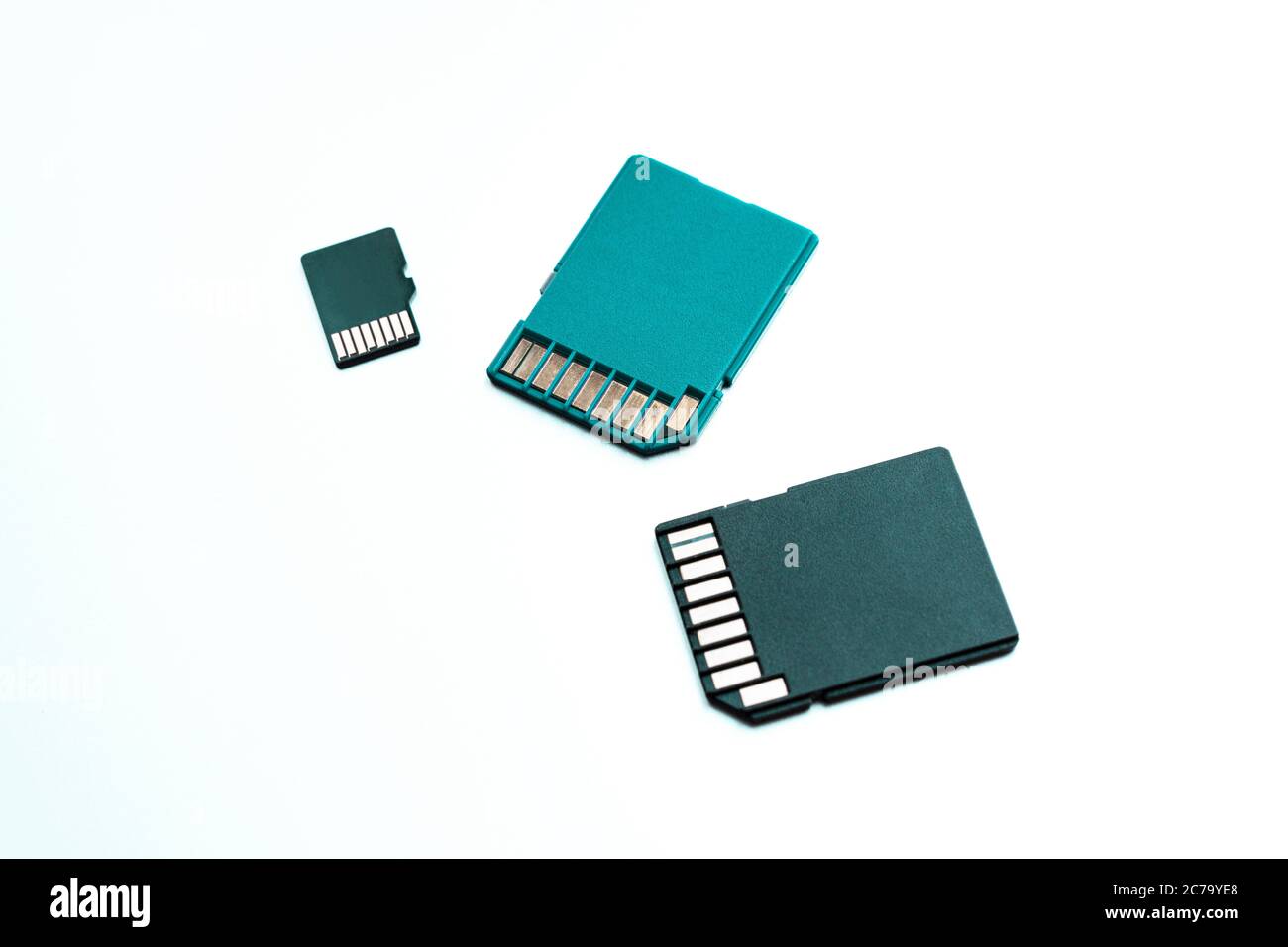 memory SD flash cards on white background with green filter. сoncept of ...