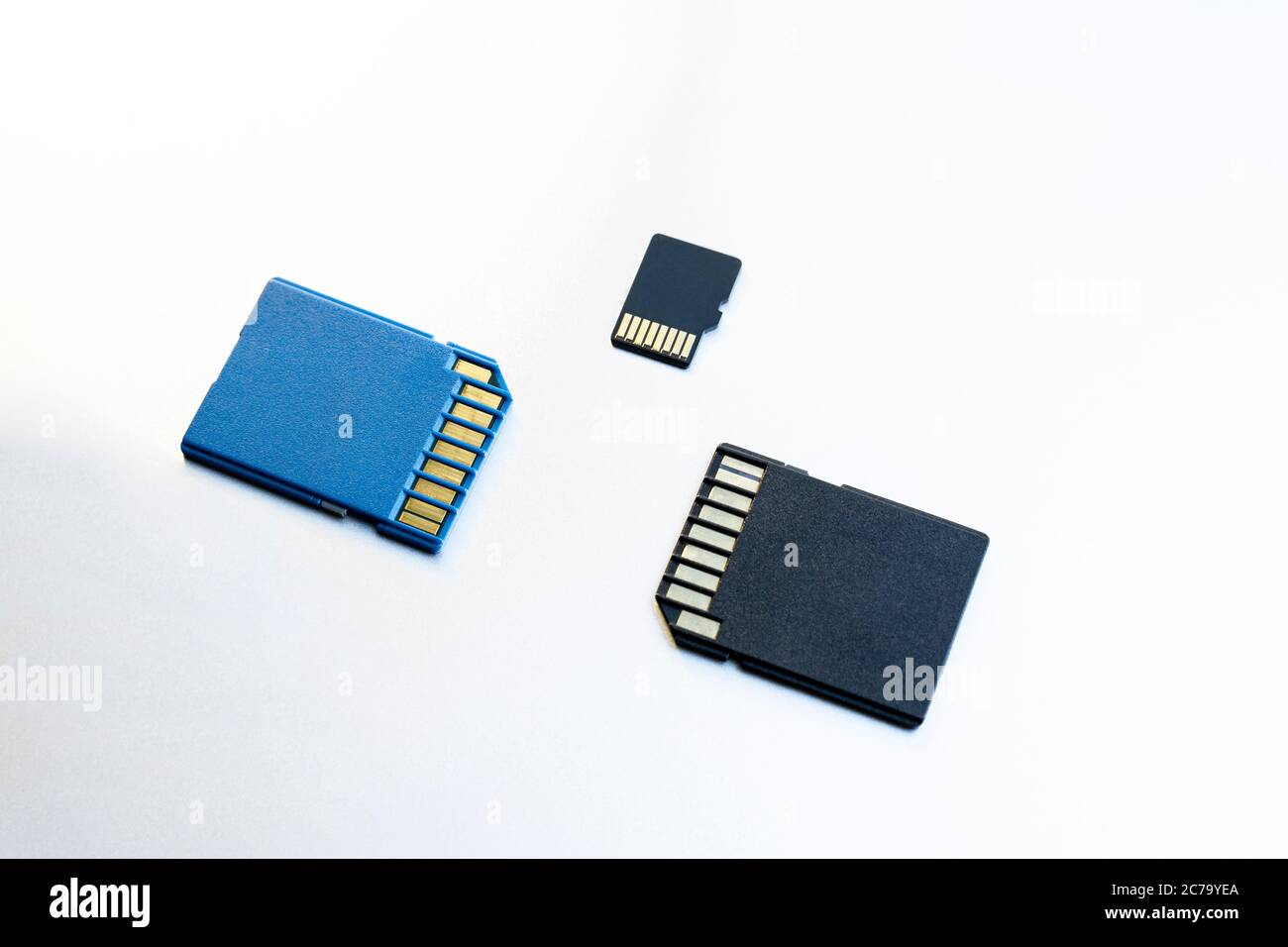 Three micro SD memory cards on gray background. blue and black memory ...