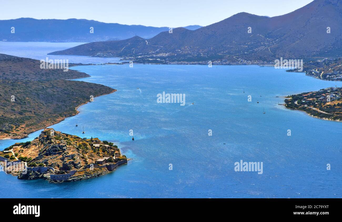 View of harbor between Spinalonga island and peninsula, known as ...