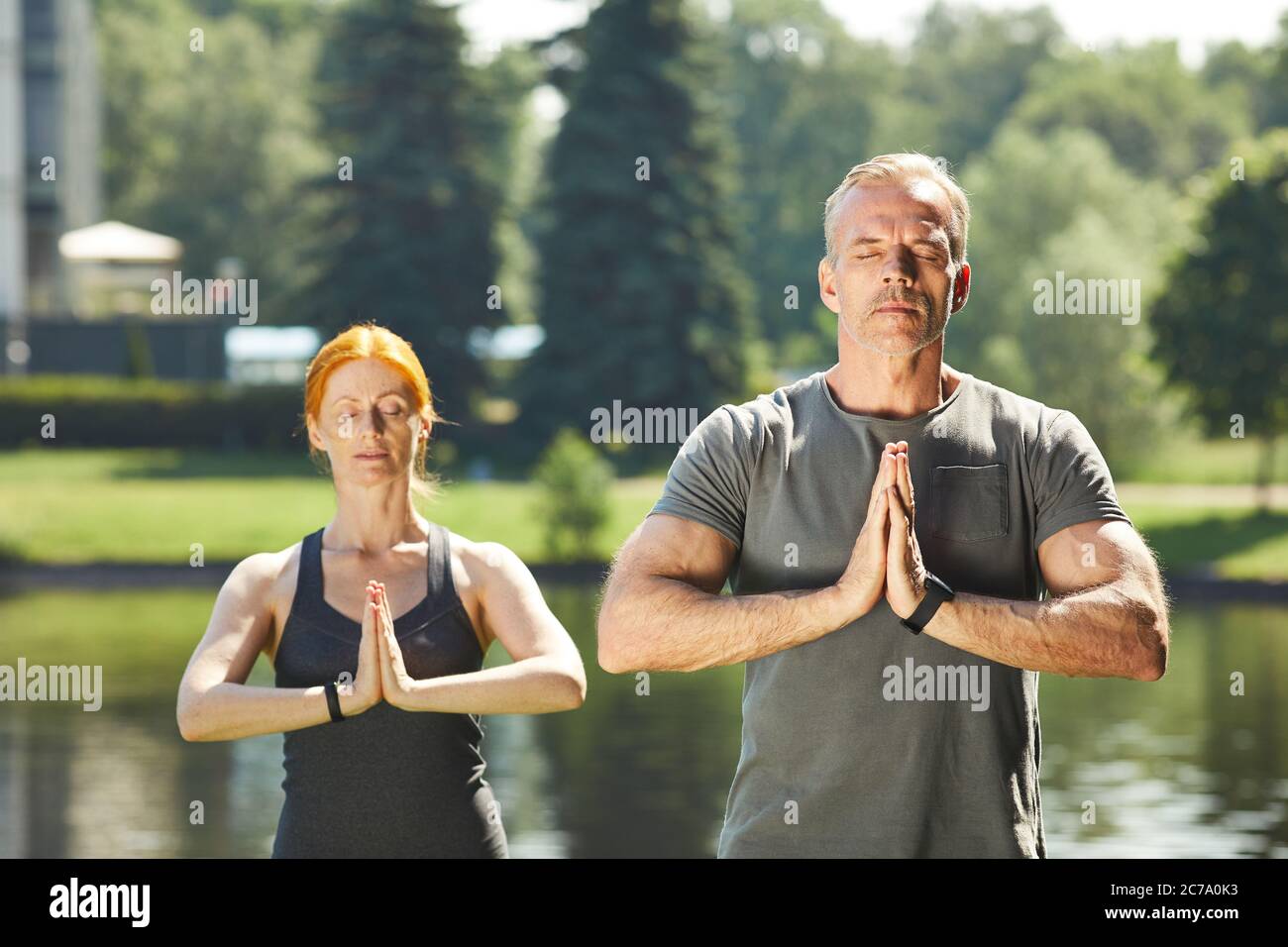 Couple meditating namaste hi-res stock photography and images - Alamy