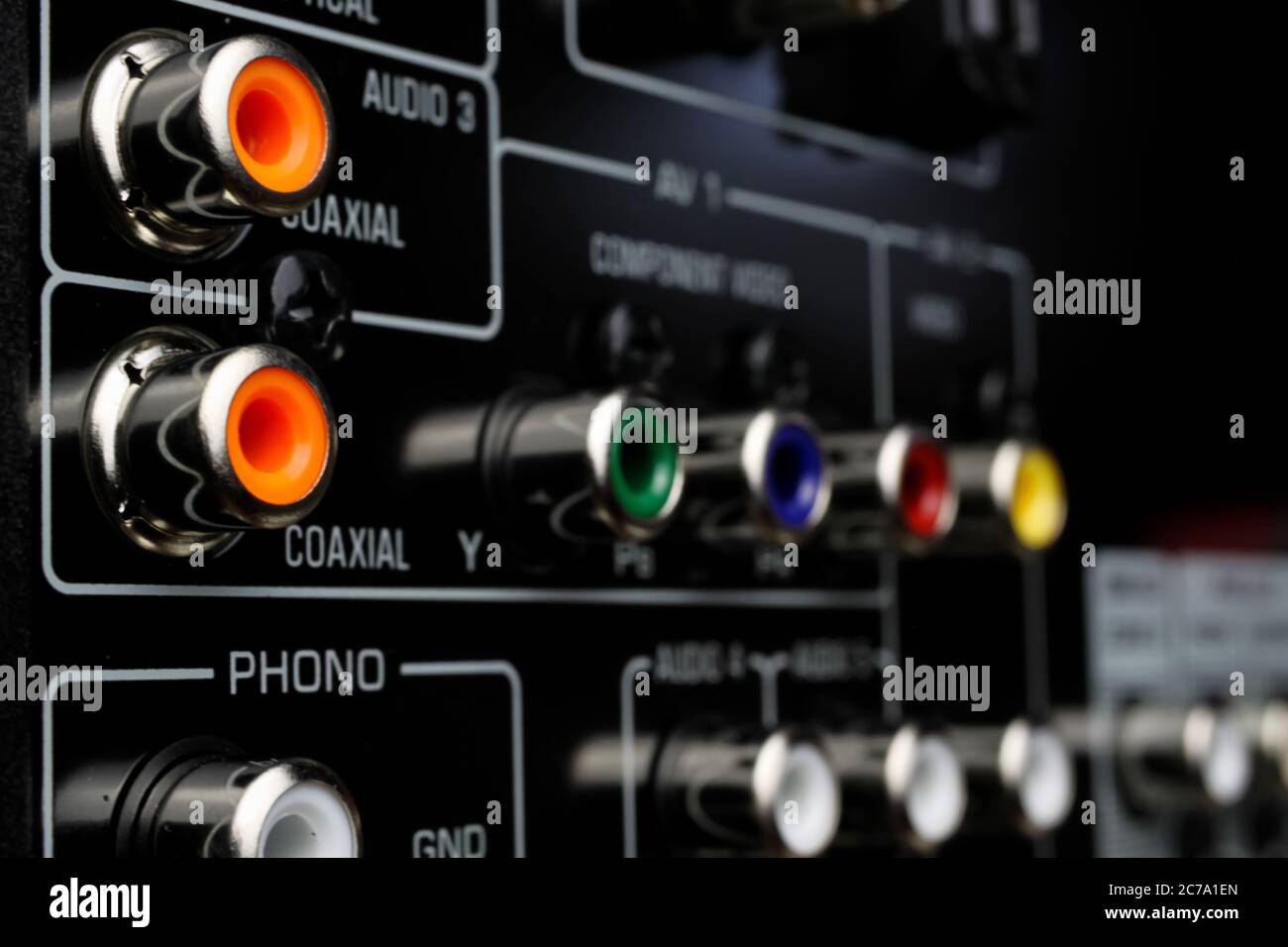 View on isolated cinch sockets of back side of black dolby surround ...