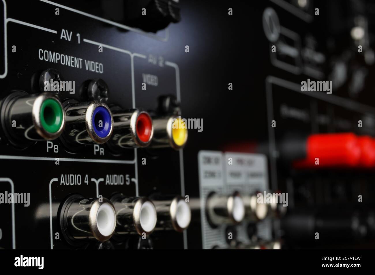 View on isolated cinch sockets of back side of black dolby surround ...