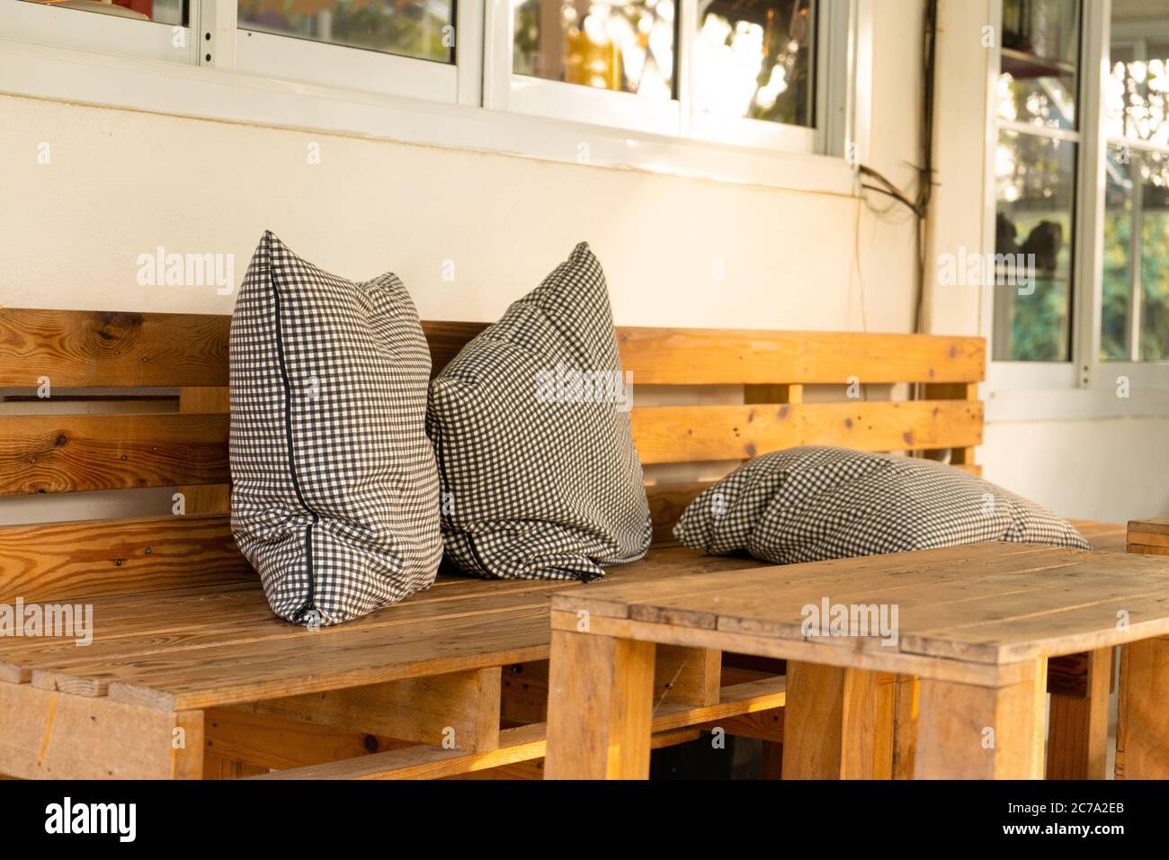 Cafe interior with furniture from pallets and checkered pillows Stock ...