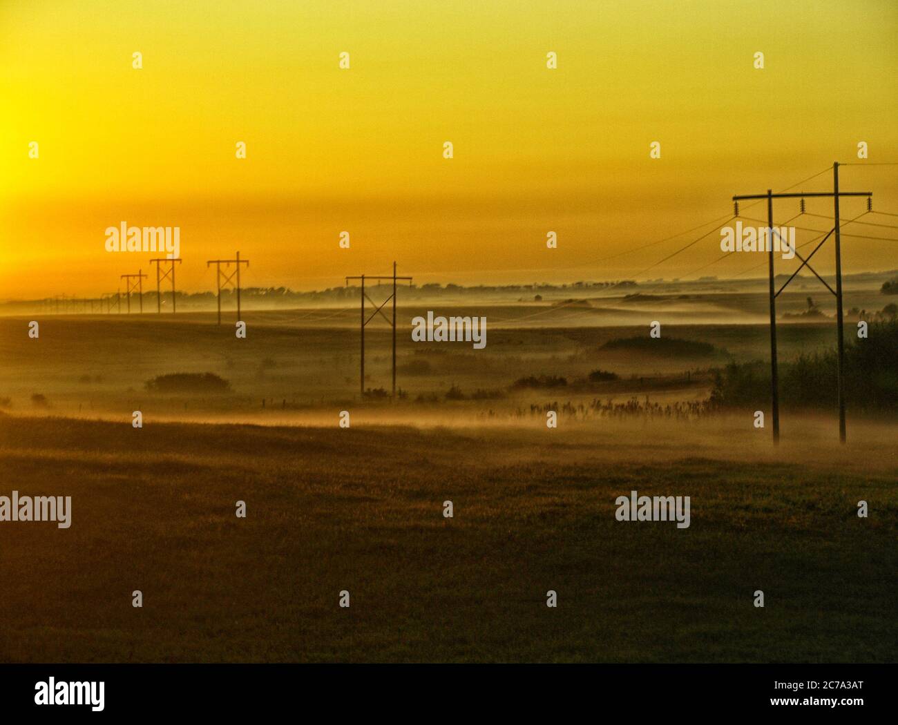 Canadian Prairie Sunrise with high-tension power-lines and some morning ...
