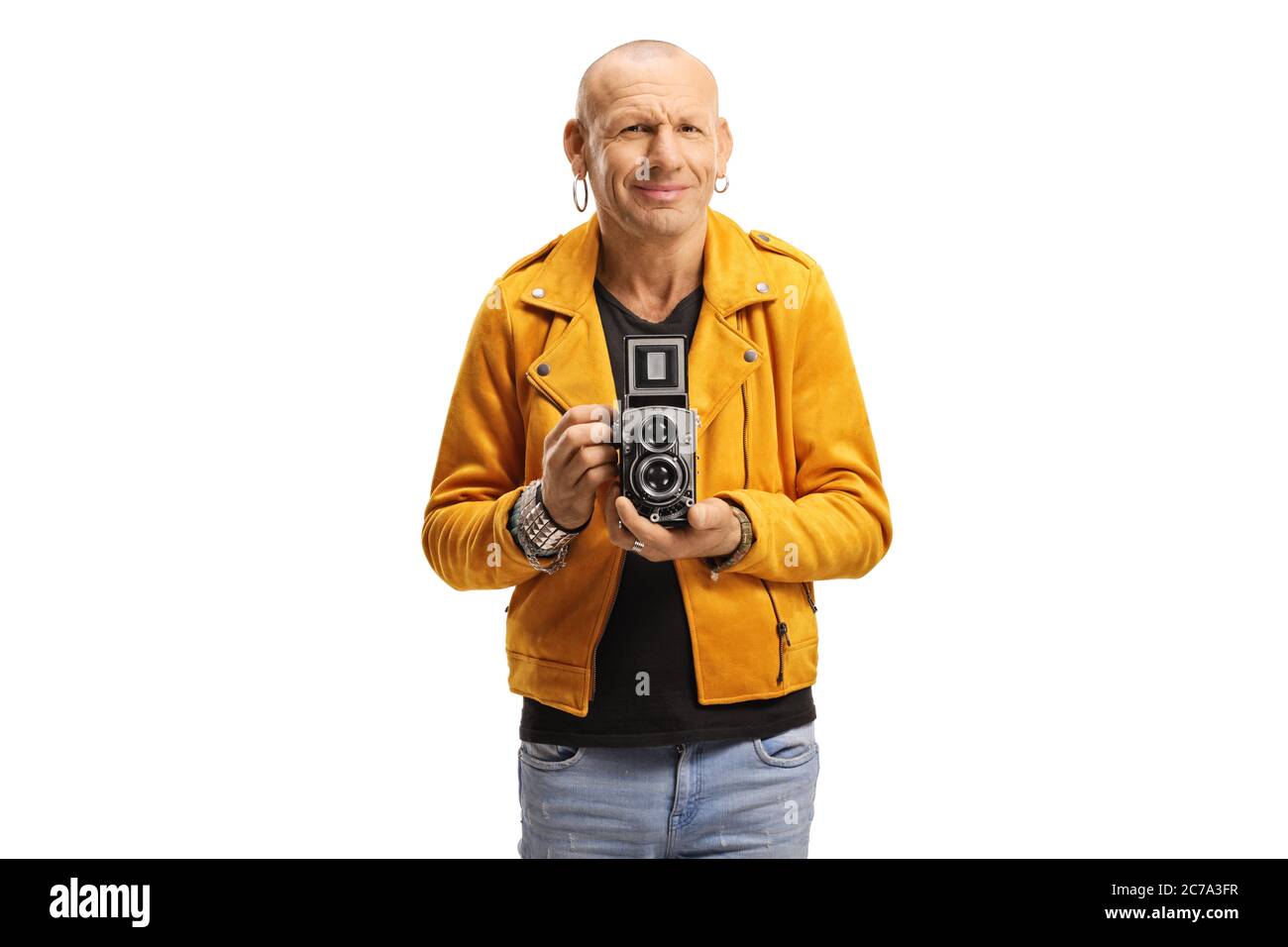 Bald man holding an old fashioned camera recorder isolated on white ...