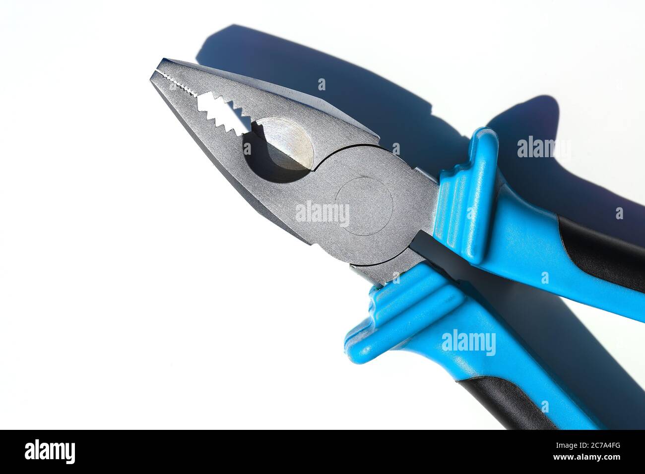 pliers closeup on white background. Extreme close up Stock Photo - Alamy