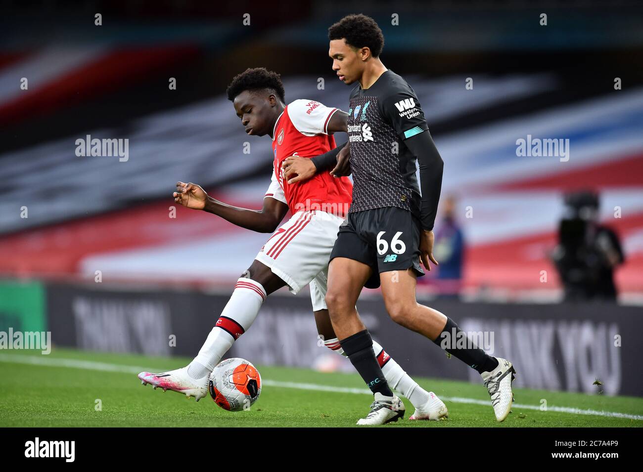 Arsenal's Bukayo Saka (left) and Liverpool's Trent Alexander-Arnold ...