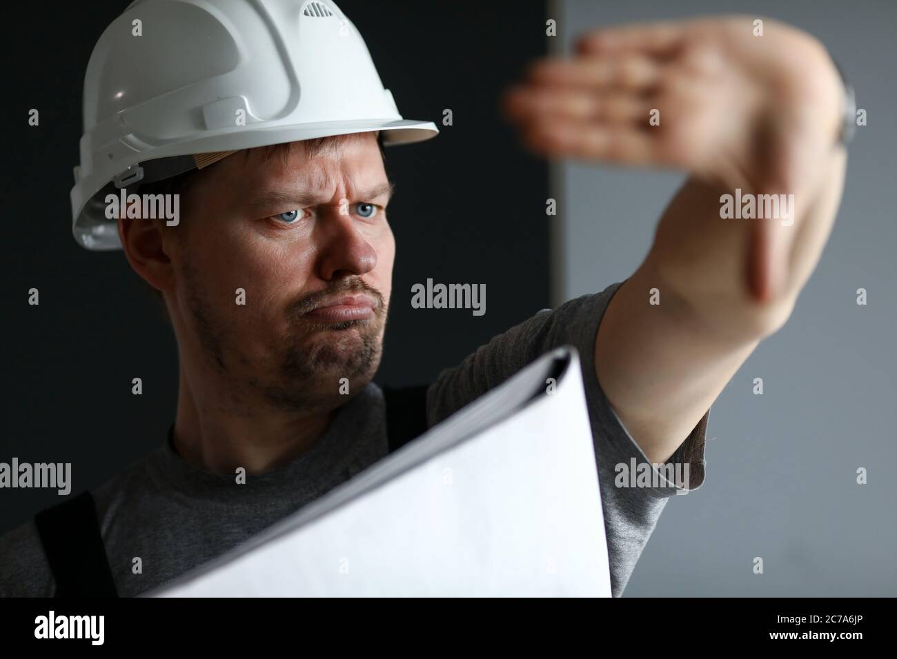 Serious handy foreman at work Stock Photo - Alamy