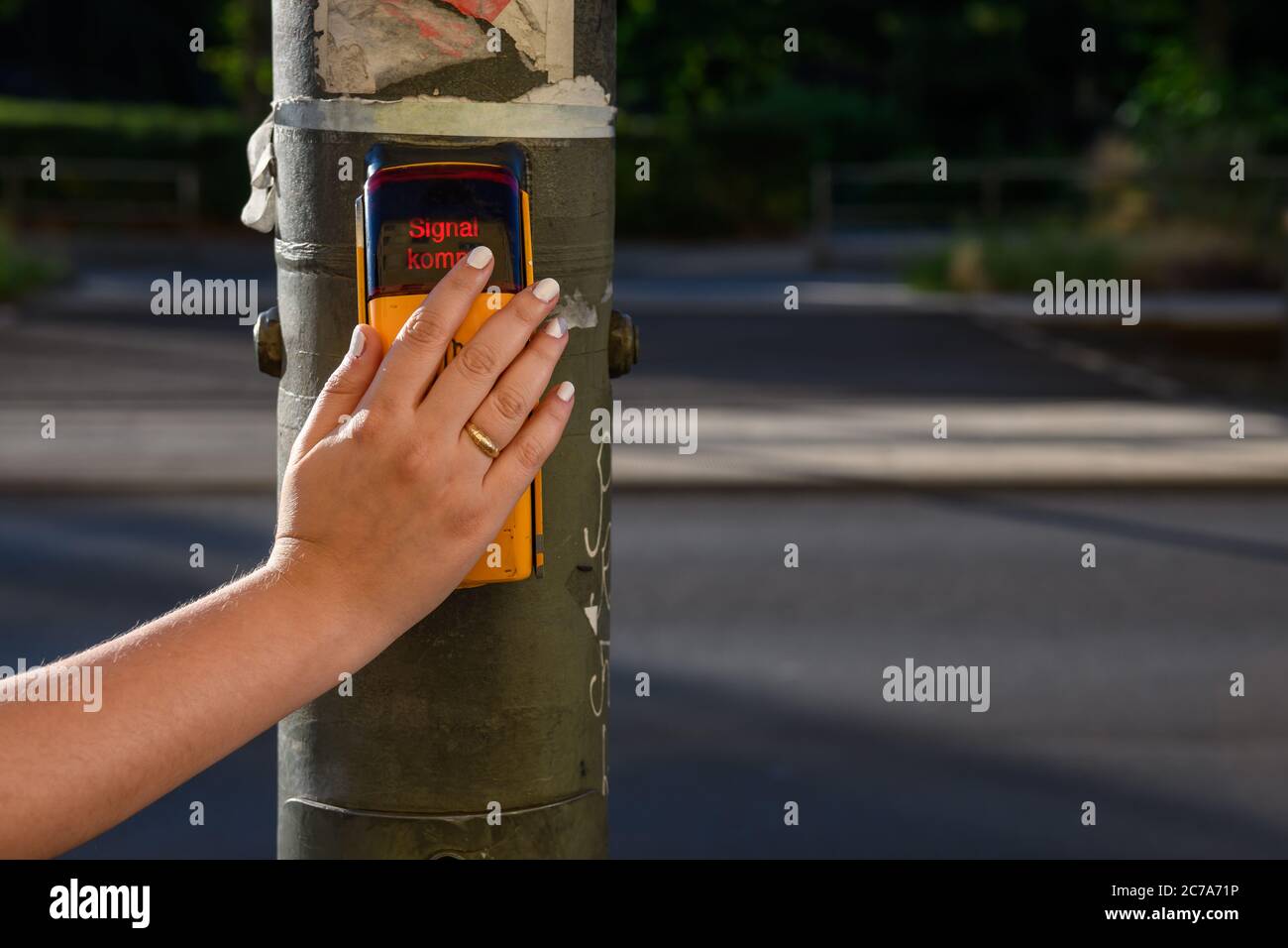Close up of an adult female hand is giving touchless stop signal for ...