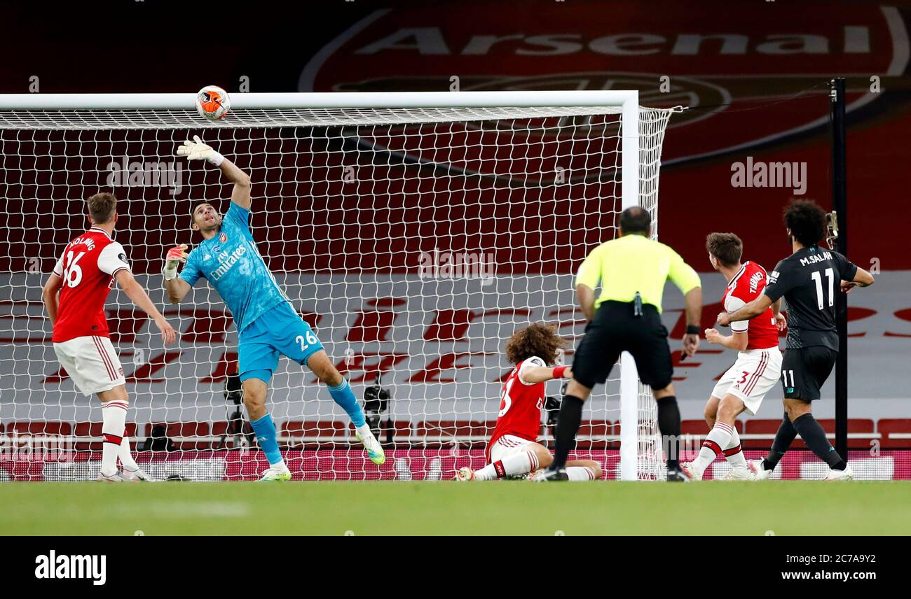 Arsenal goalkeeper Emiliano Martinez saves a shot from Liverpool's ...