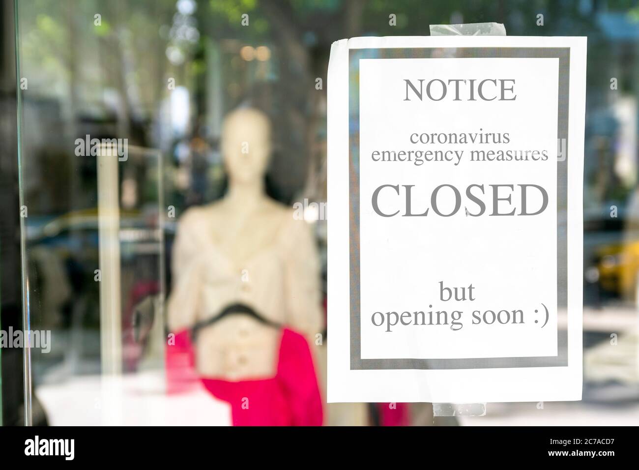 Closeed notice because of Coronavirus measures on window of a boutique ...