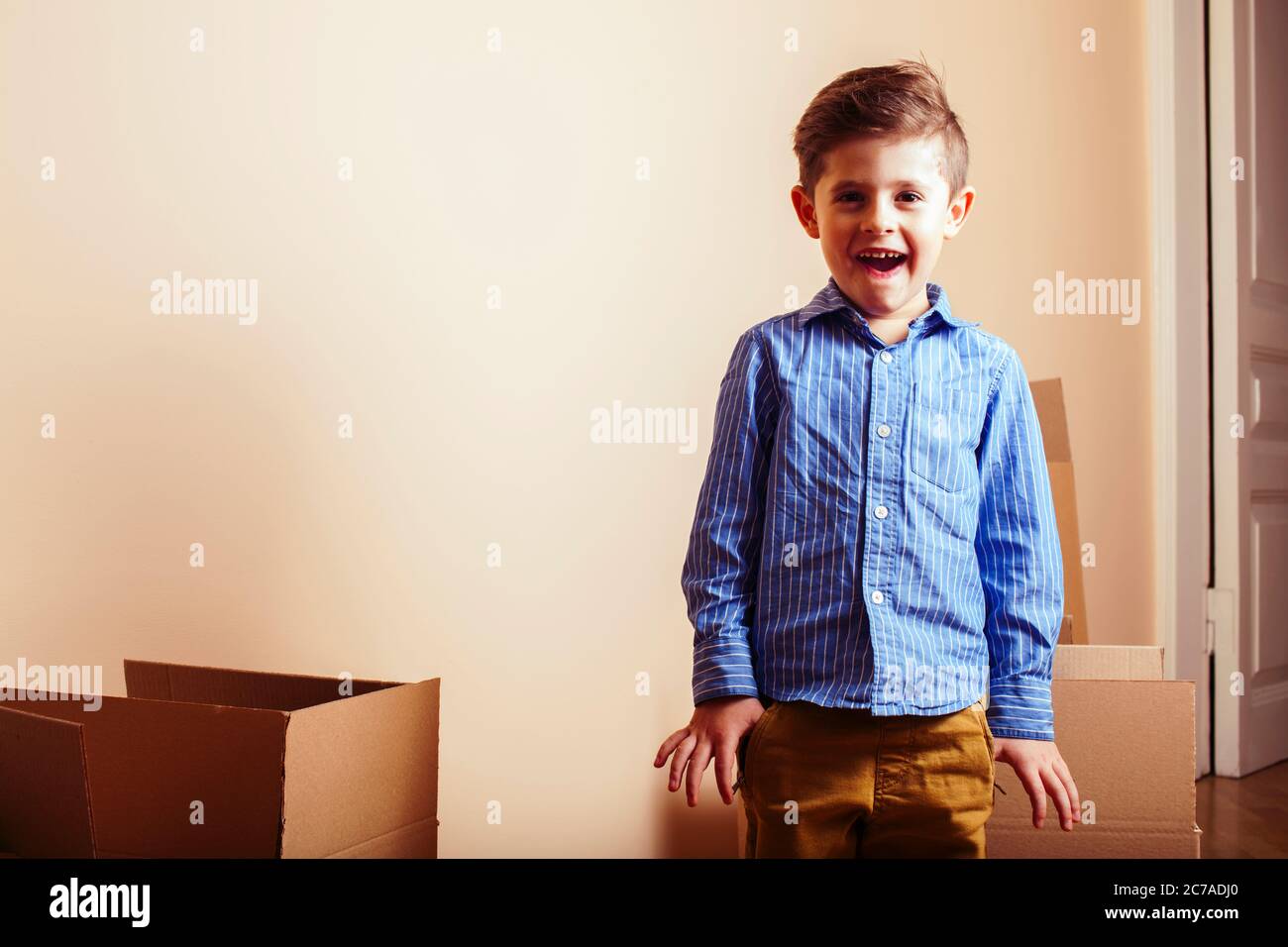 little cute boy in empty room, move to new house. home alone among ...
