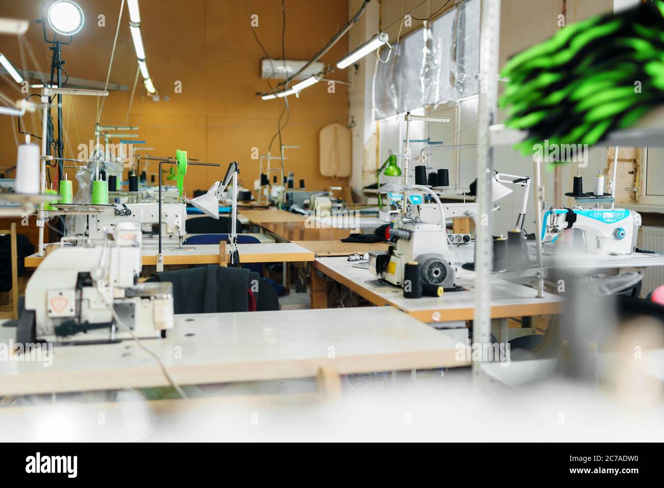 Sewing department of a textile factory interior Stock Photo - Alamy