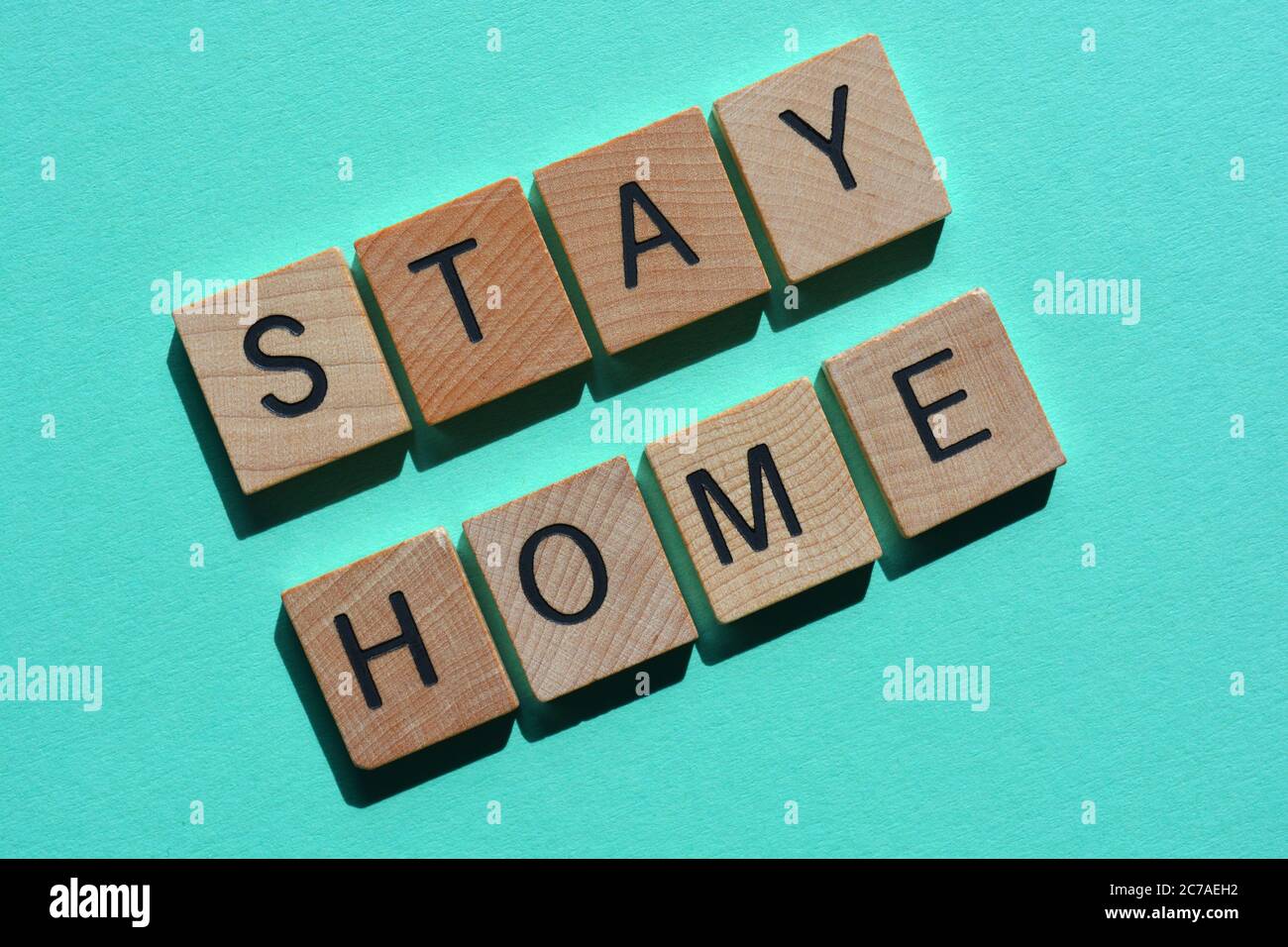 Stay Home, words in wooden alphabet letters isolated on green Stock ...