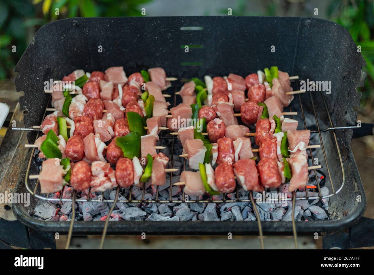 Meat skewers on the barbecue Stock Photo - Alamy