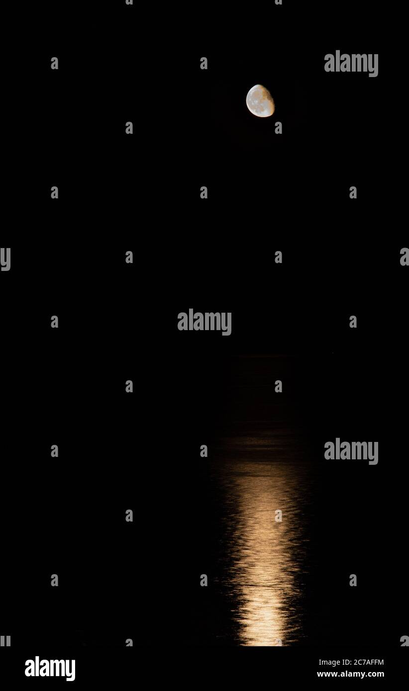 Reflection of the moonlight over the sea Stock Photo - Alamy