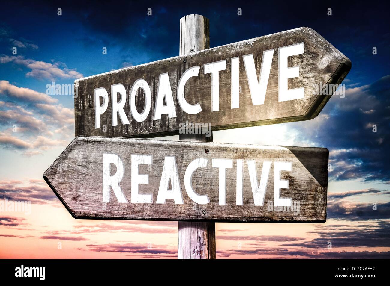 Proactive, reactive - wooden signpost, roadsign with two arrows Stock ...