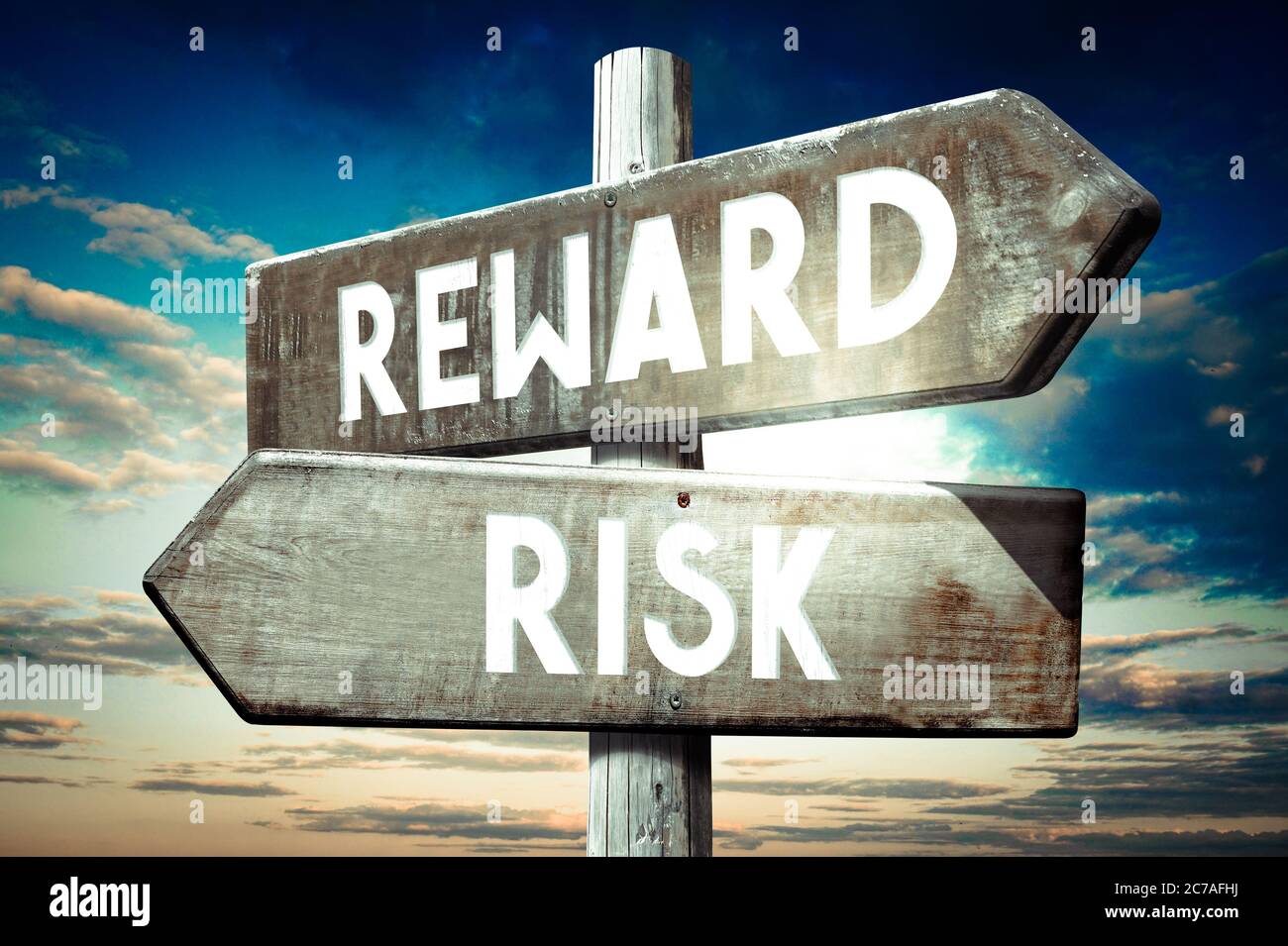 Risk, reward - wooden signpost, roadsign with two arrows Stock Photo ...