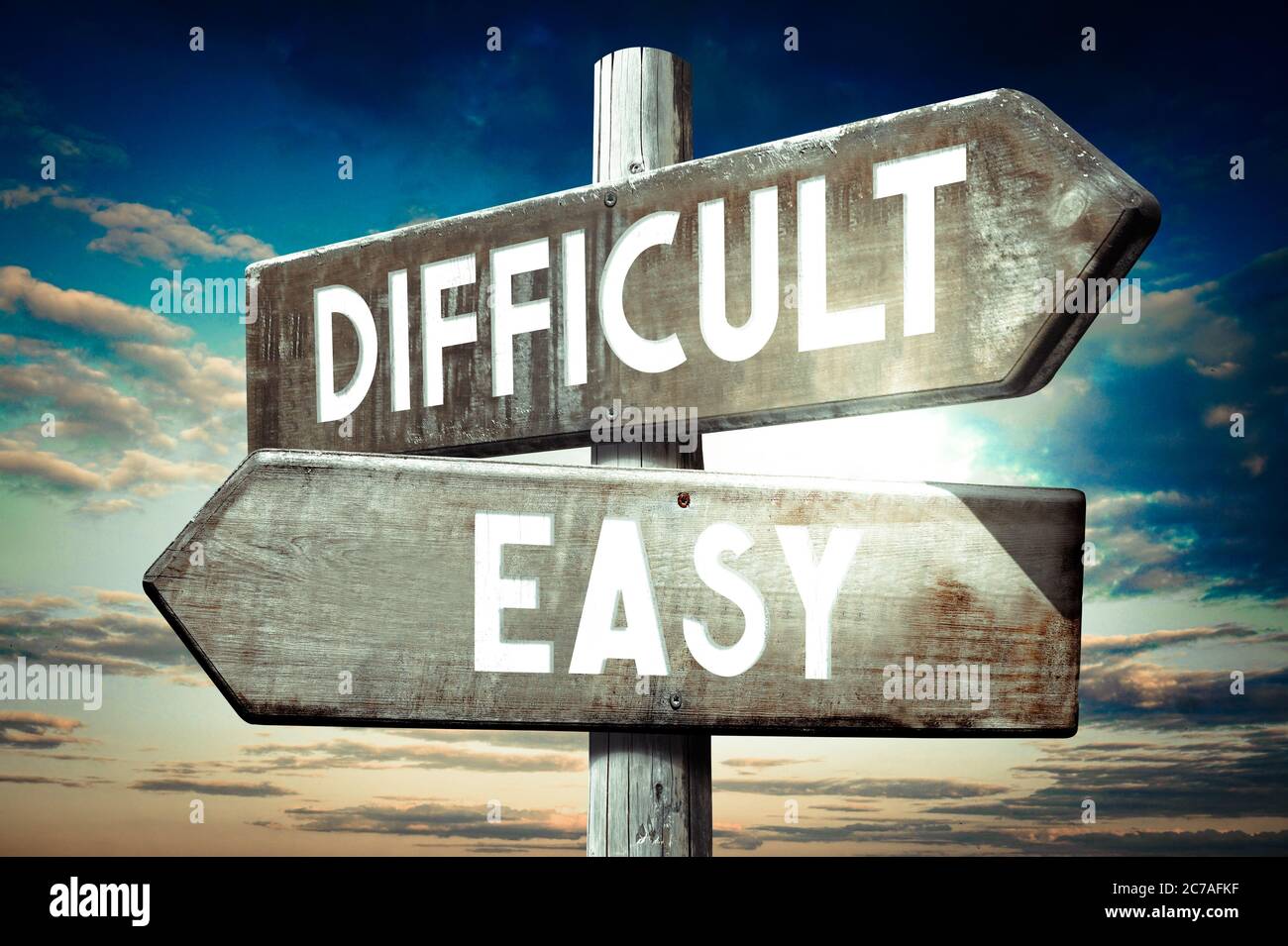 Difficult, easy - wooden signpost, roadsign with two arrows Stock Photo ...