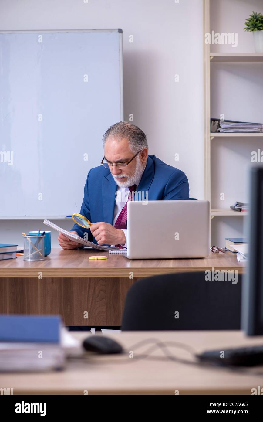 Male boss employee working in the office Stock Photo - Alamy