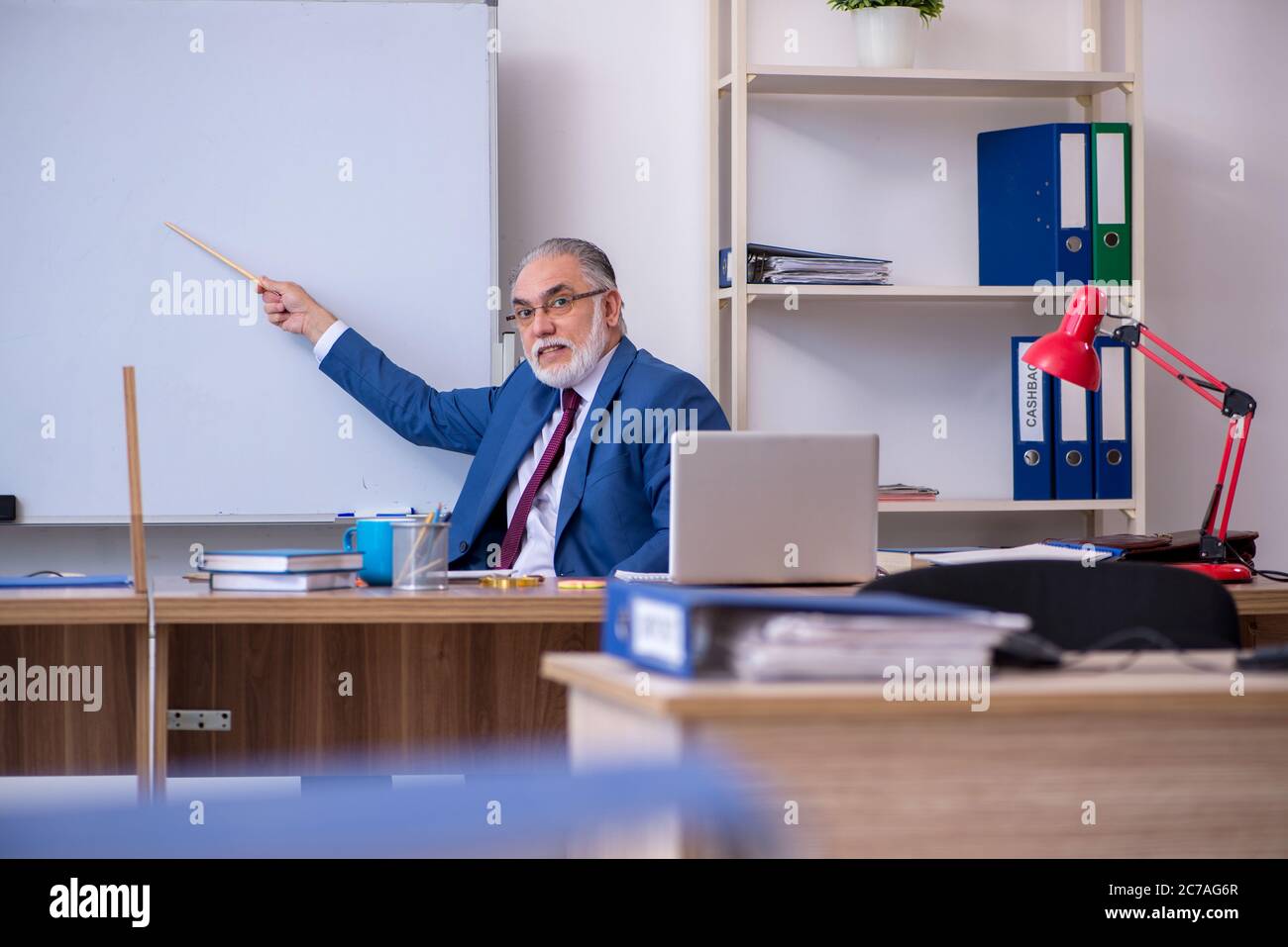 Male boss employee working in the office Stock Photo - Alamy