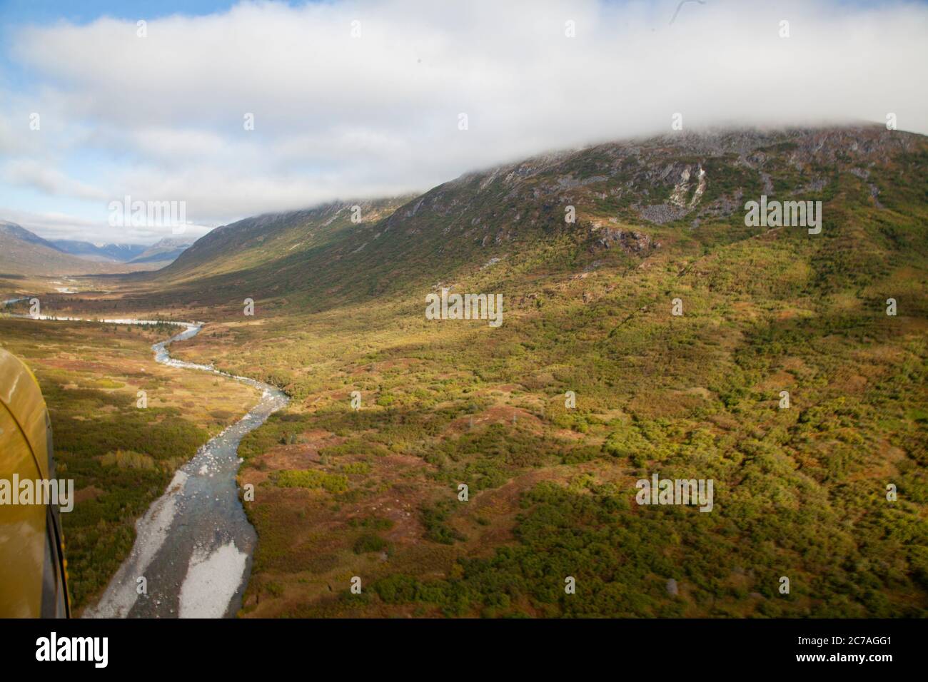 A stunning aerial view of a winding river flowing through a lush ...