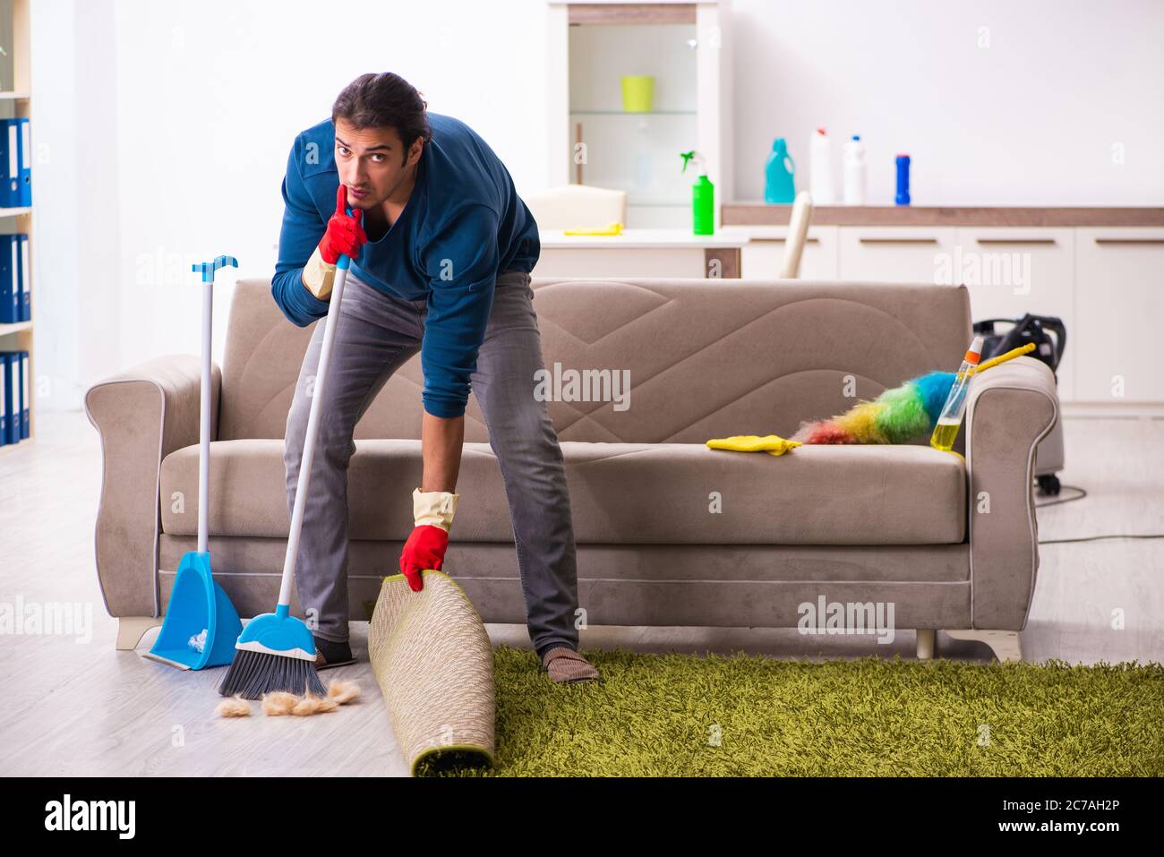 Young man husband doing housework Stock Photo - Alamy