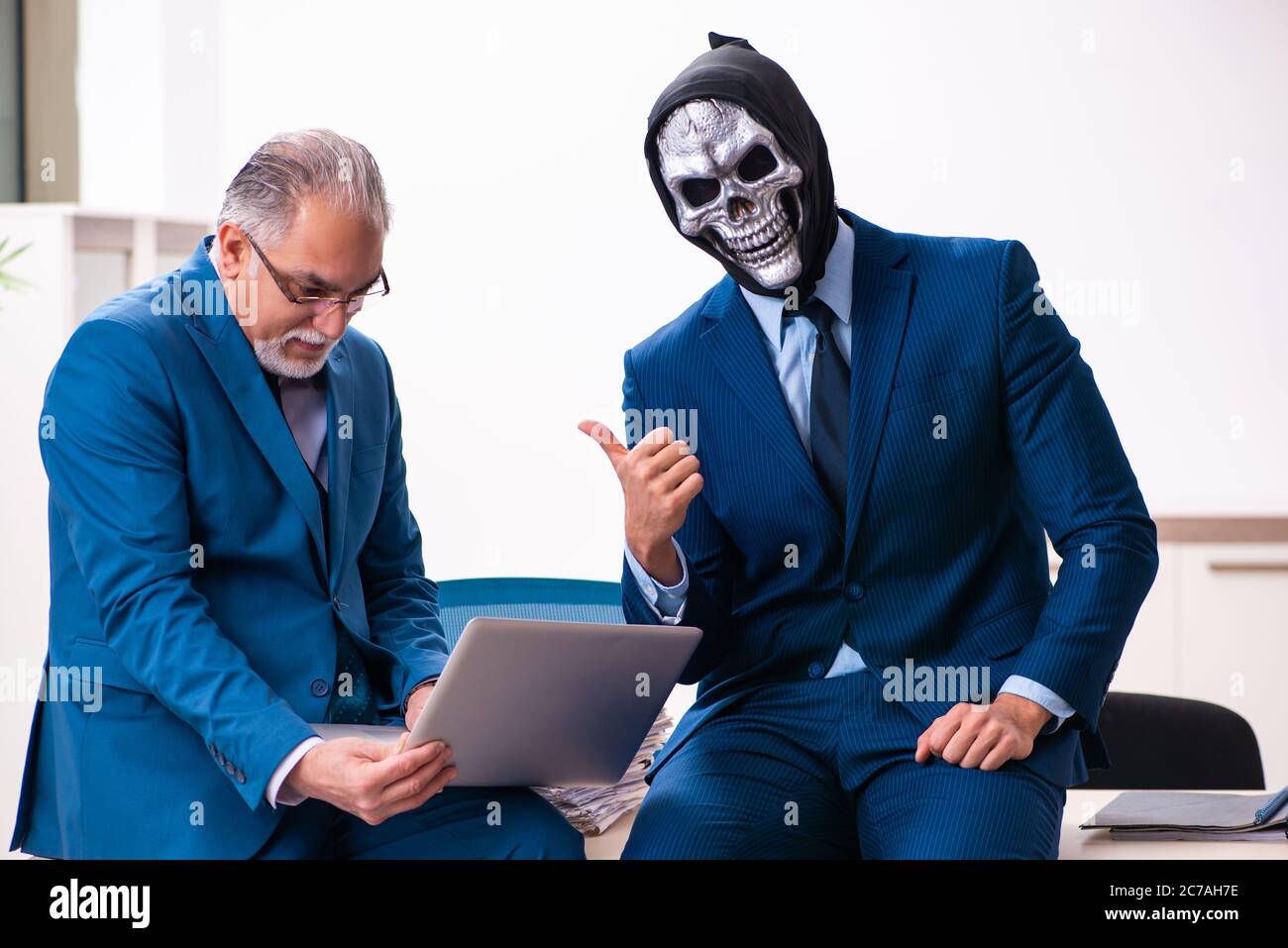 Old businessman employee making deal with the devil Stock Photo - Alamy