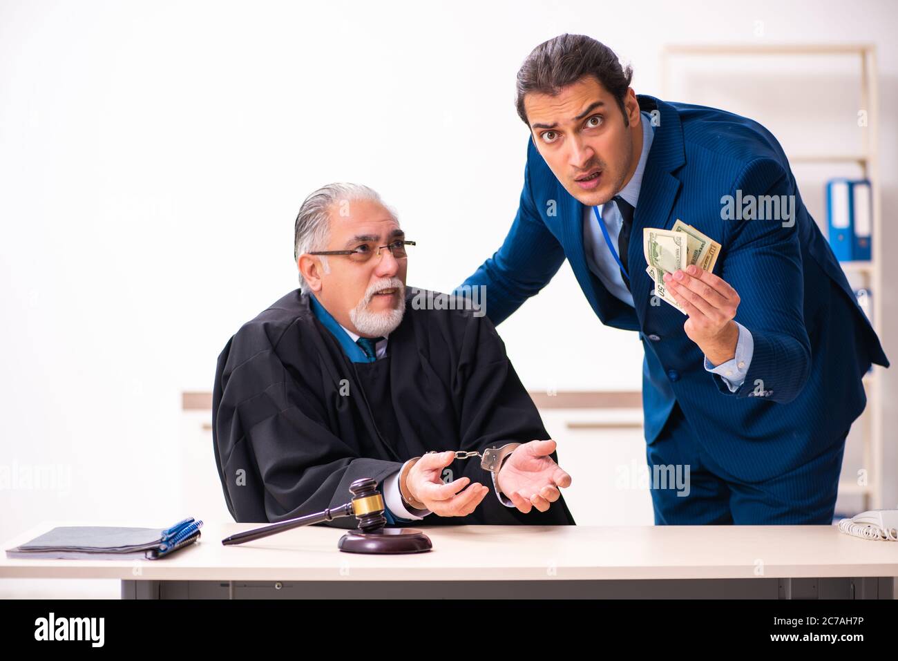 Policeman arresting suspect hi-res stock photography and images - Alamy