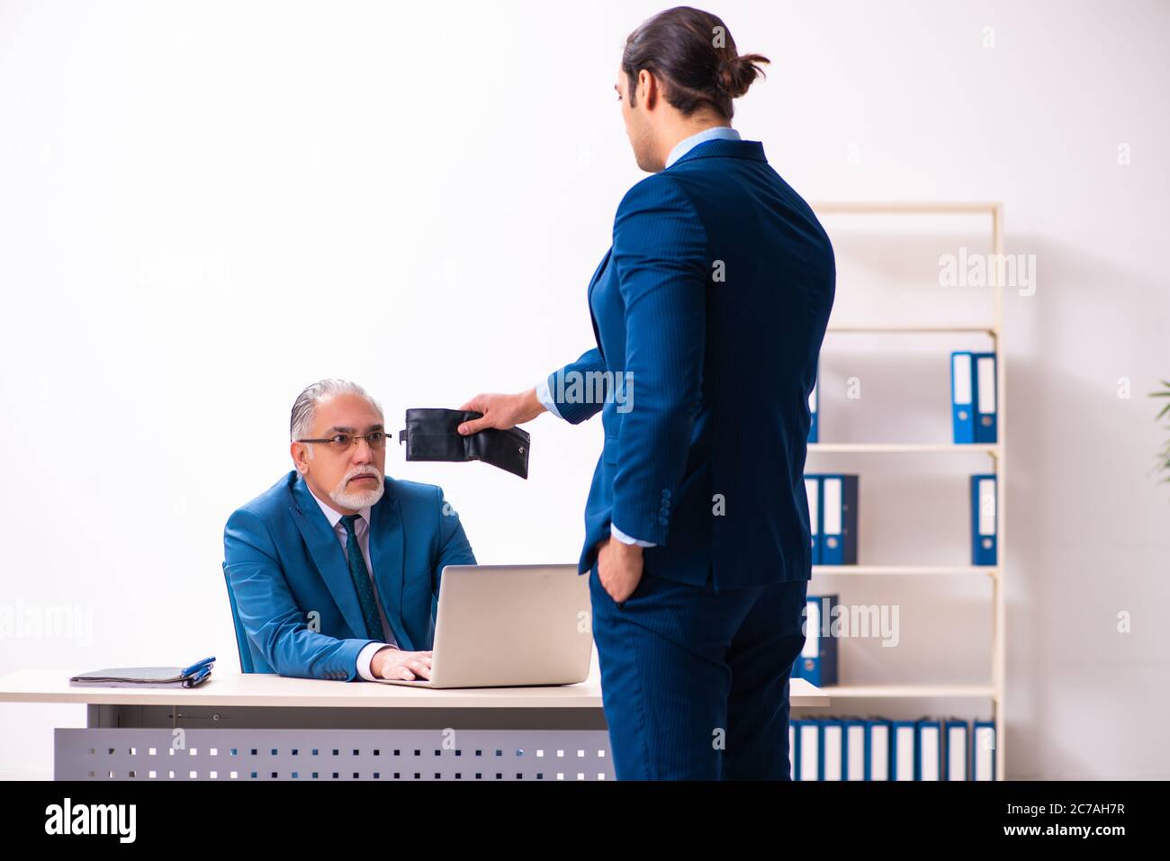 Male employee and cop in police investigation Stock Photo - Alamy