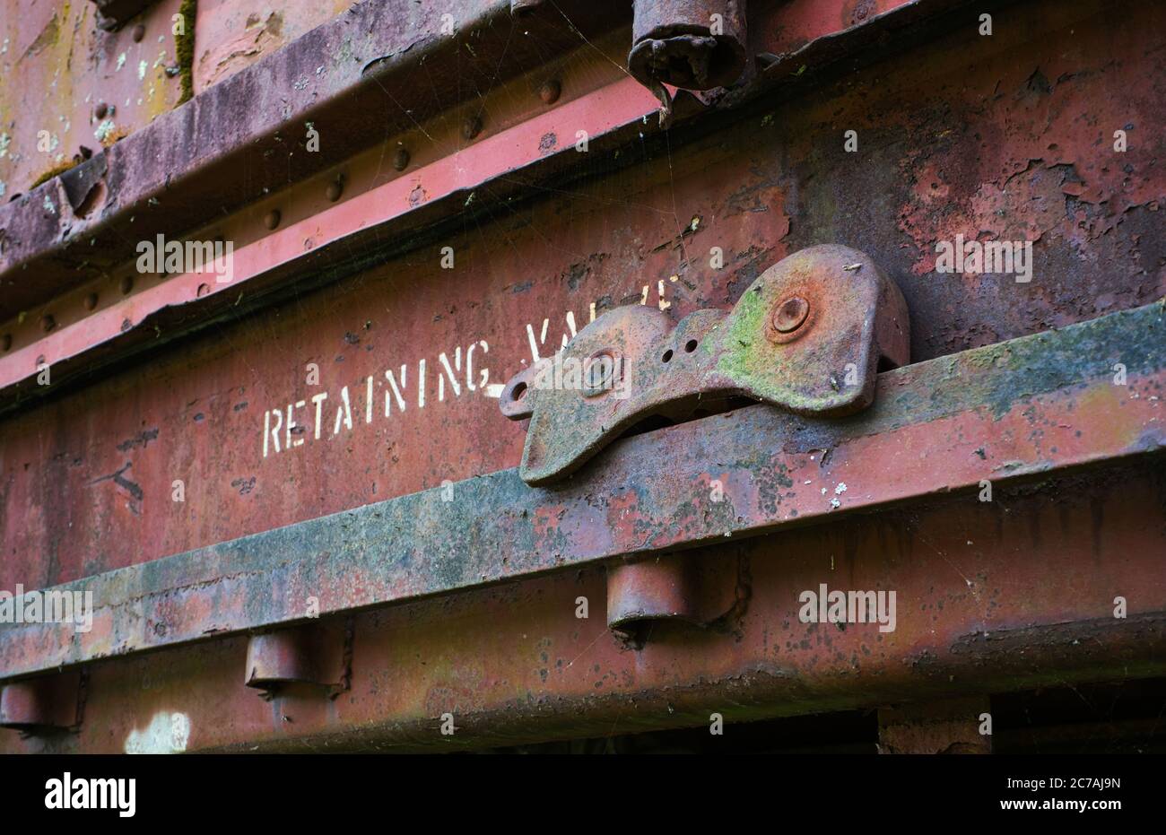 Close up of the retaining valve on the air brakes of a railroad car ...