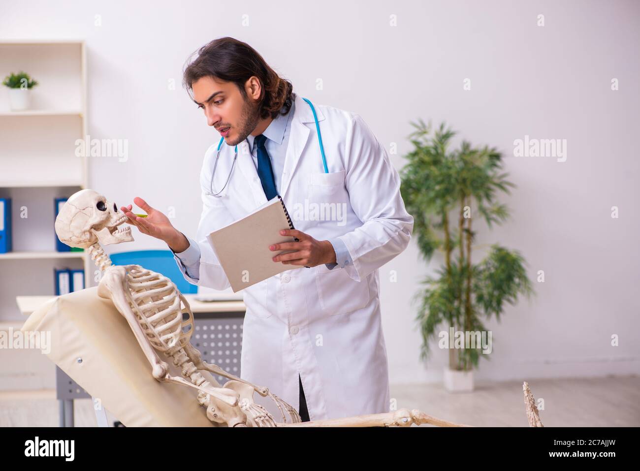 Crazy doctor examining the dead patient Stock Photo - Alamy