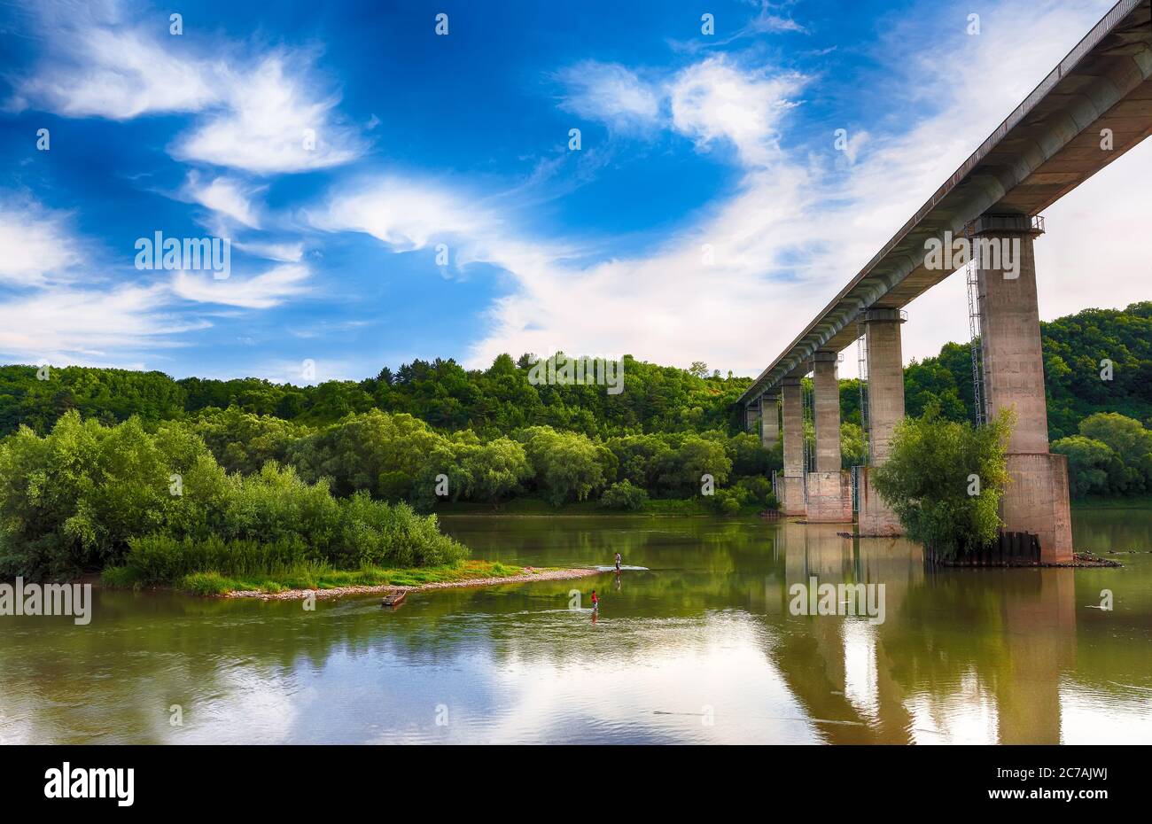 Huge arch bridge built over Dnister river in Ukraine. Beautiful clouds ...