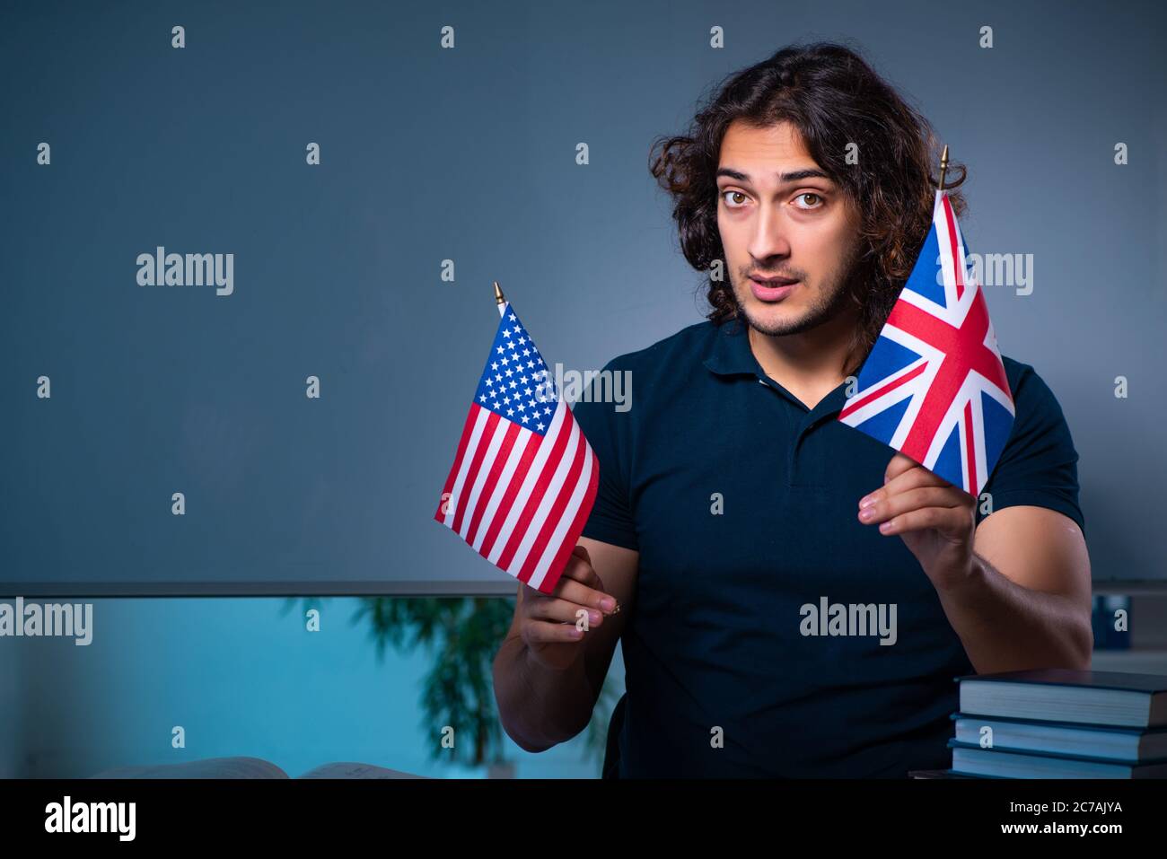Young student in the classroom at night Stock Photo - Alamy