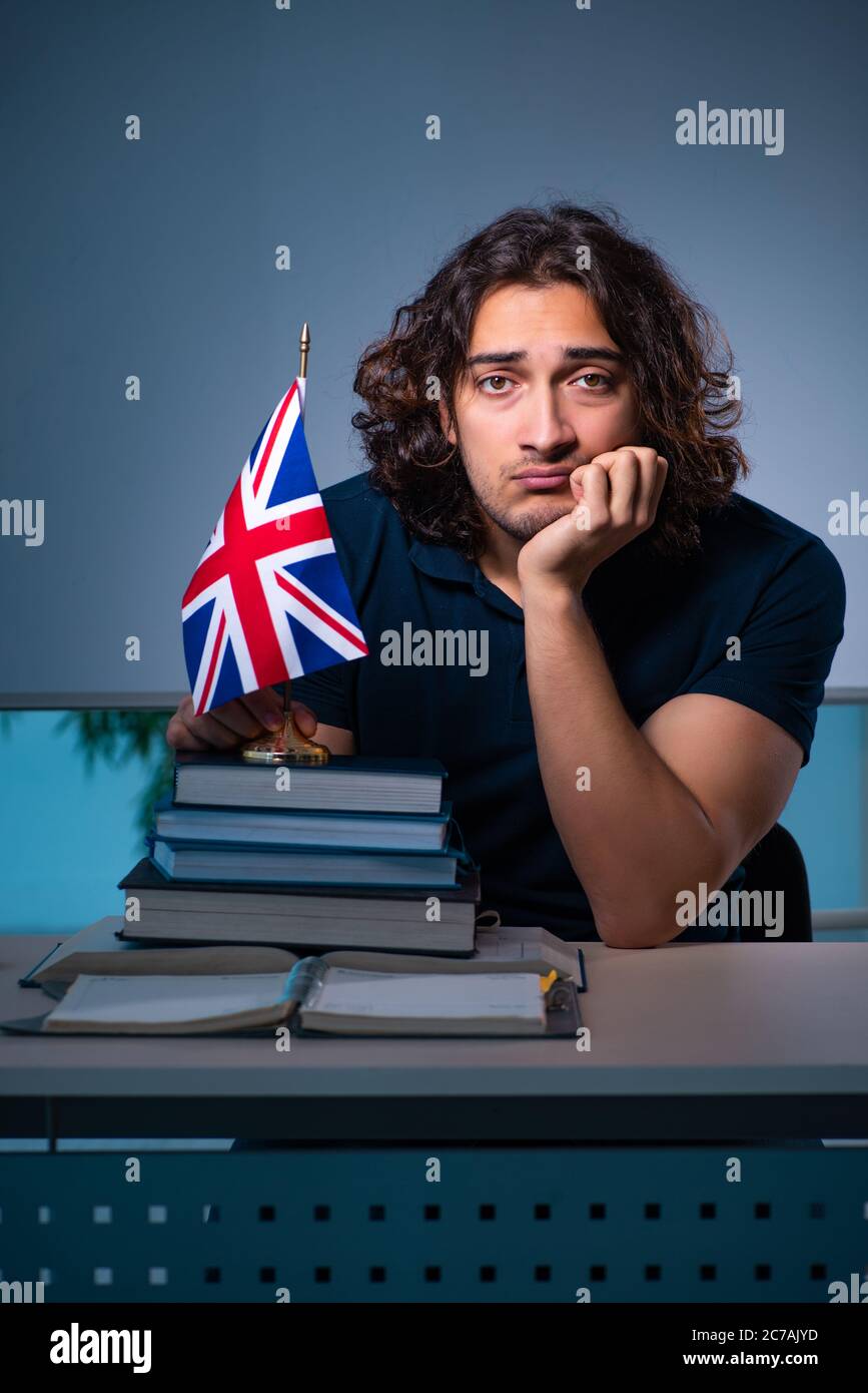 Young student in the classroom at night Stock Photo - Alamy
