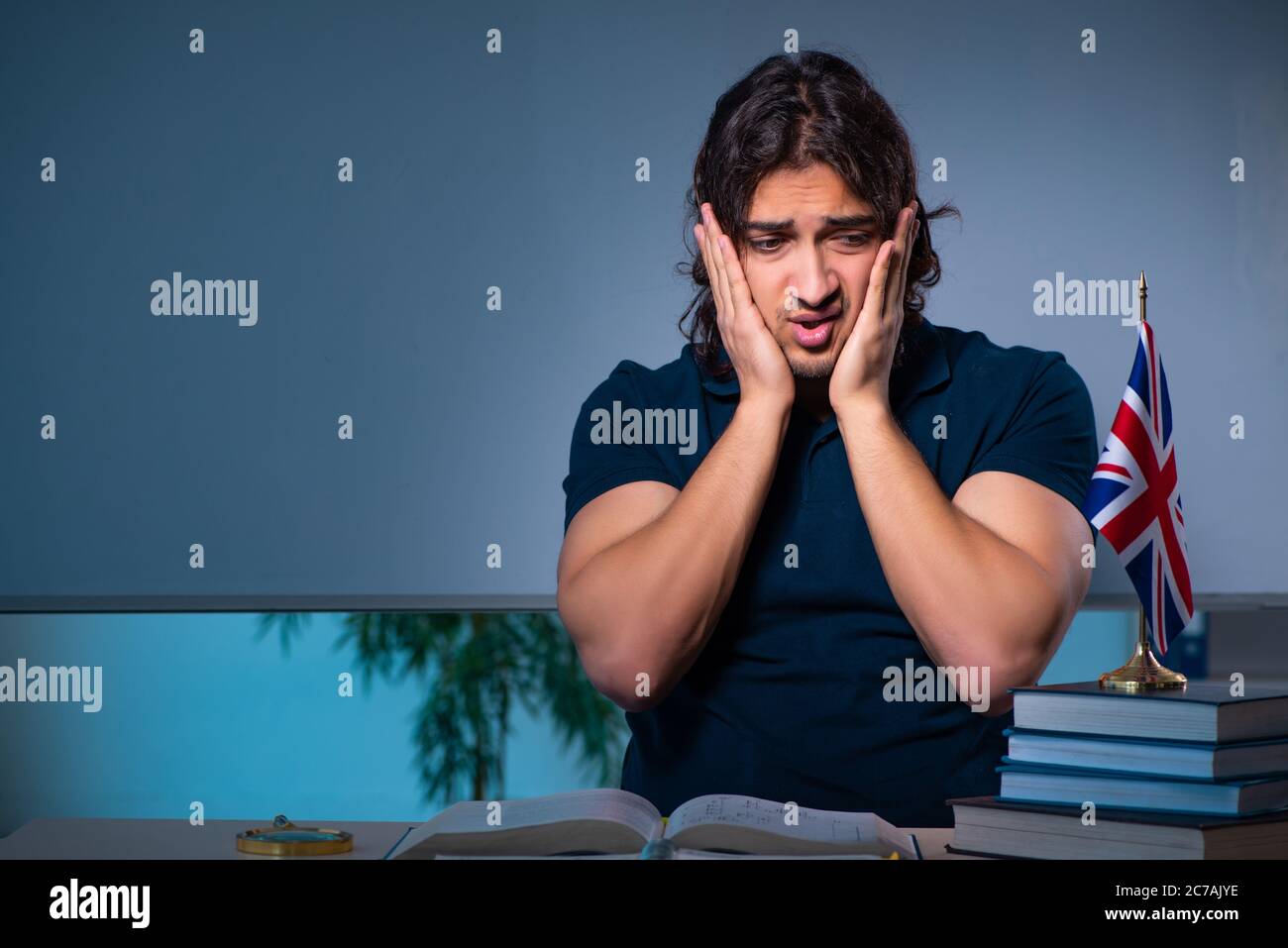Young student in the classroom at night Stock Photo - Alamy
