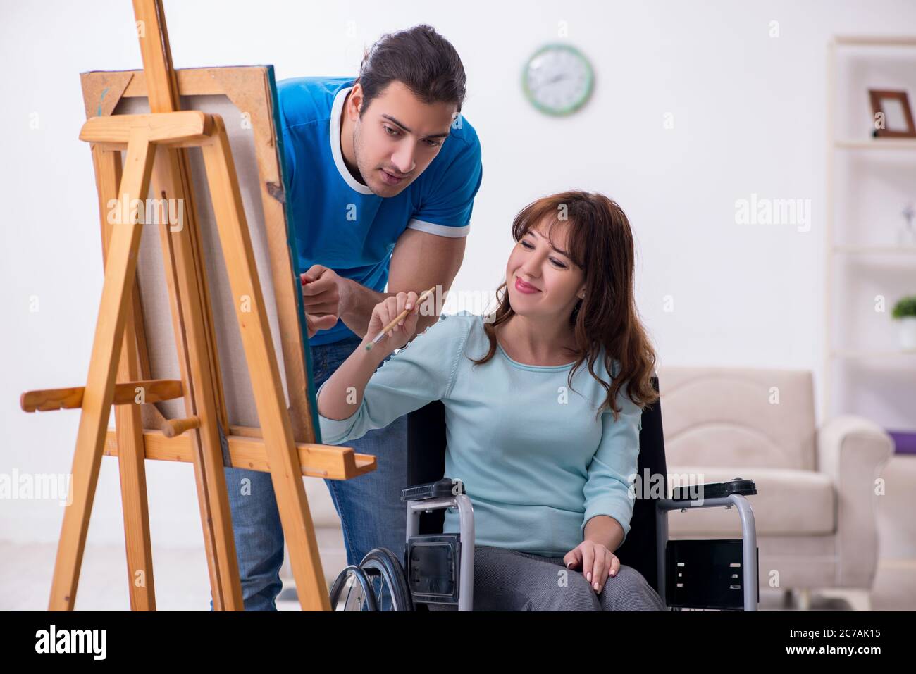 Disabled wife and husband at home Stock Photo - Alamy