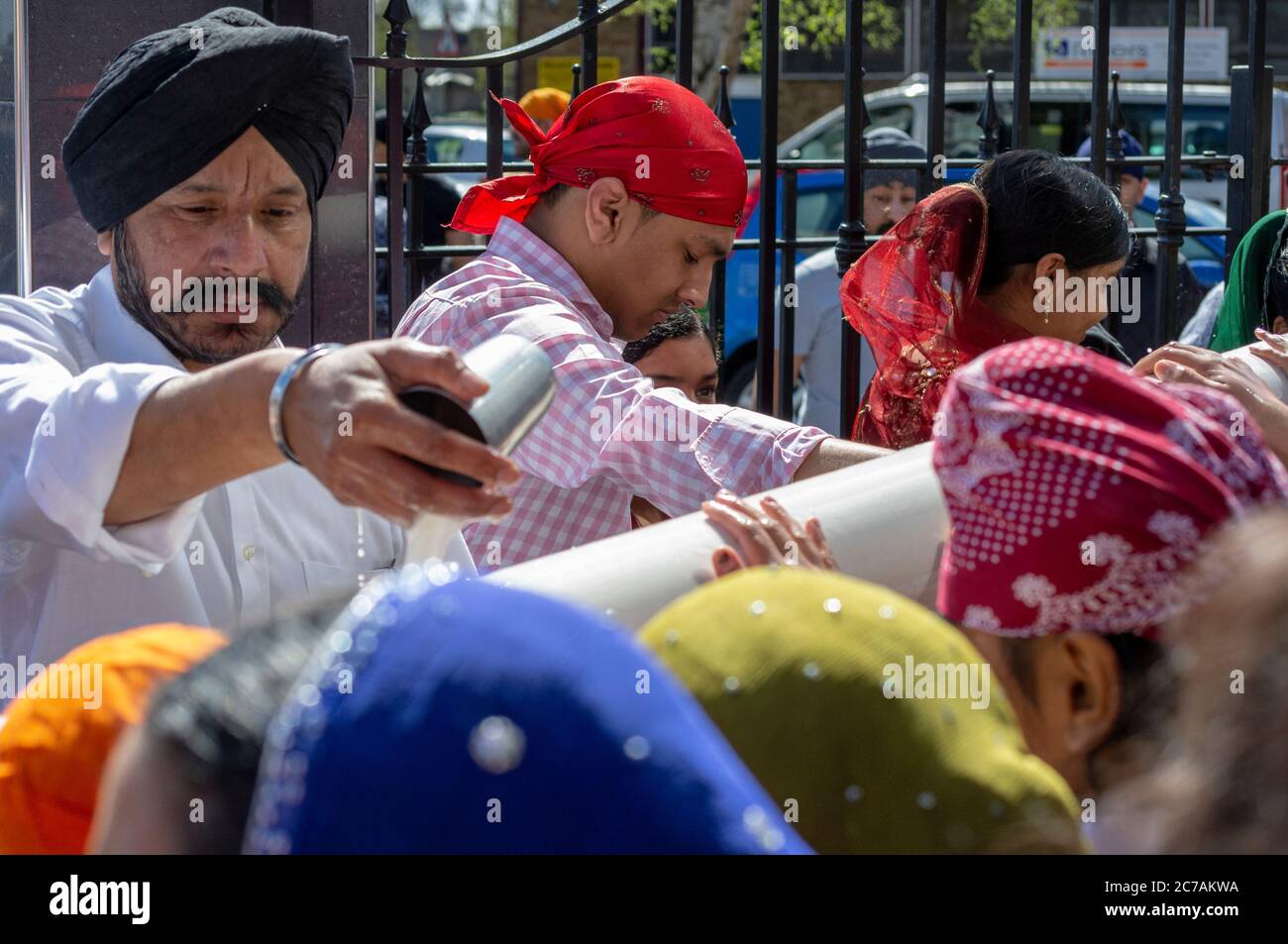 The Sikh cleaning a mast with the traditional Gurdwara flag Stock Photo ...