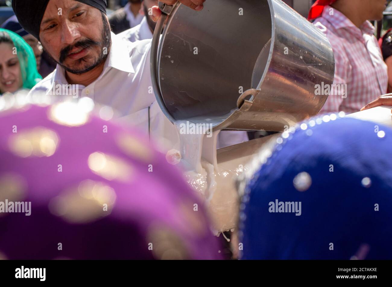 The Sikh cleaning a mast with the traditional Gurdwara flag Stock Photo ...