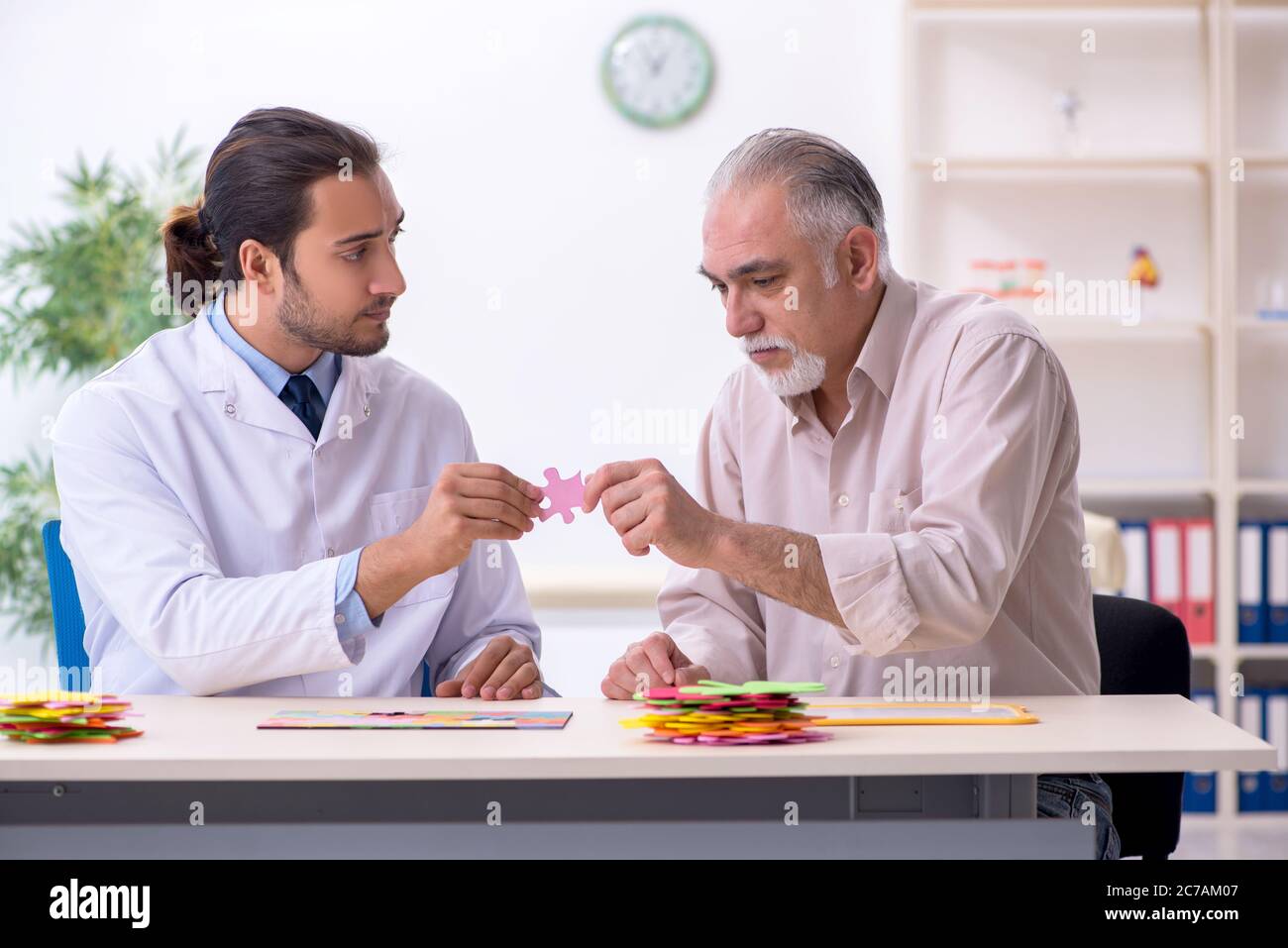 Doctor and patient suffering from the Alzheimer disease Stock Photo - Alamy