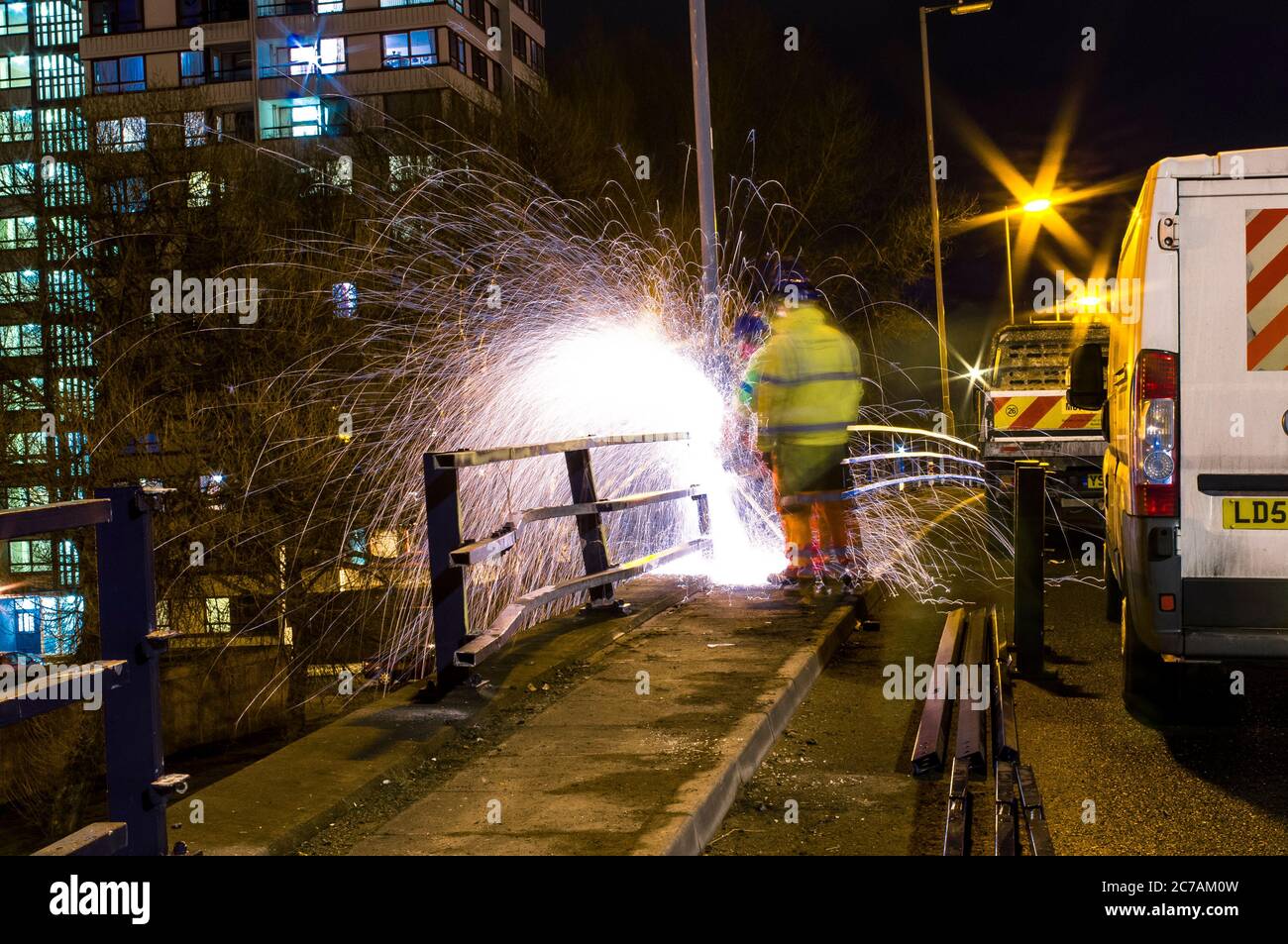 Street maintenance crew in the night shift, working on the bridge Stock ...