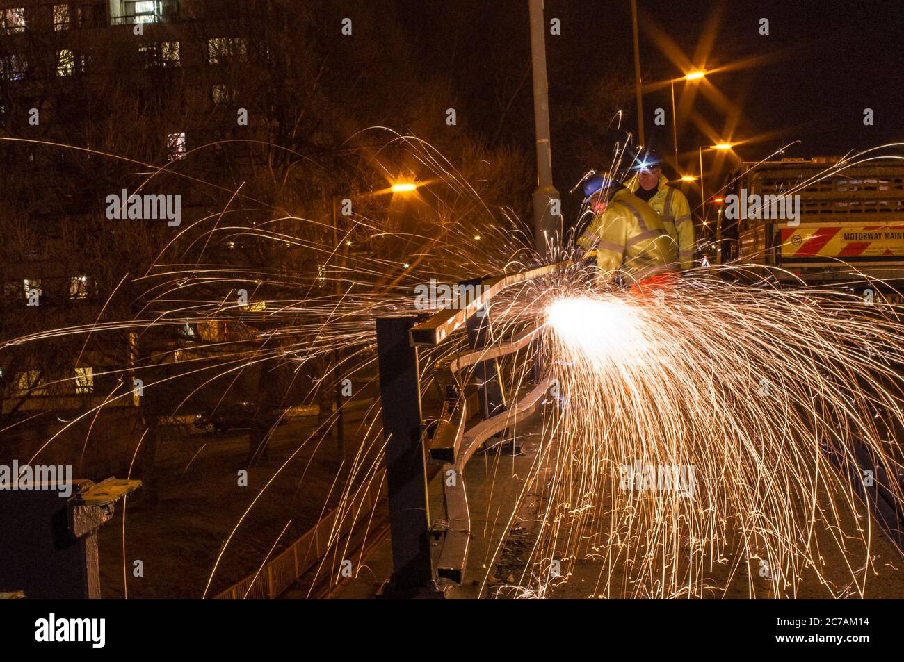 Street maintenance crew in the night shift, working on the bridge Stock ...