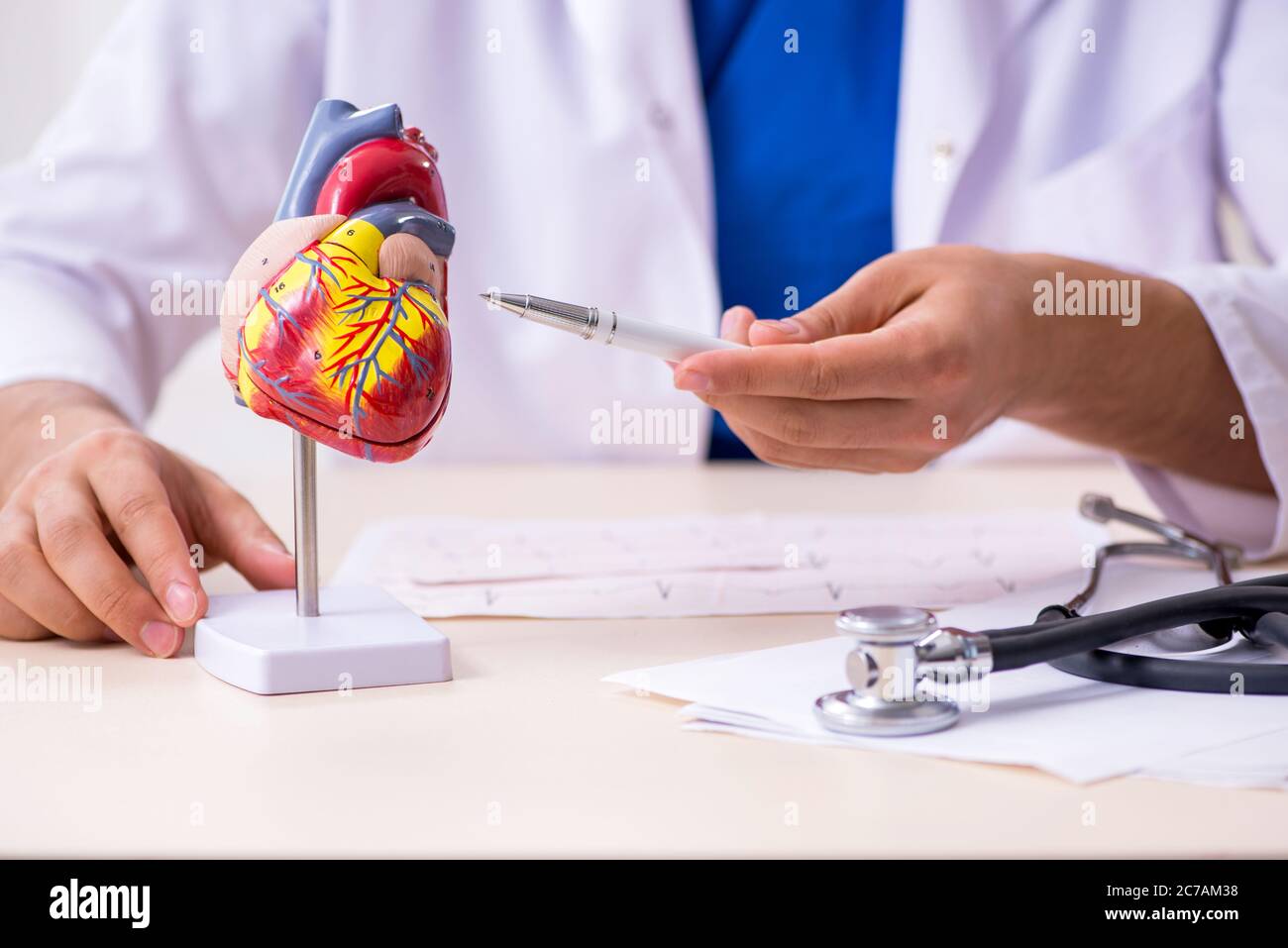 Young doctor cardiologist working in the clinic Stock Photo - Alamy