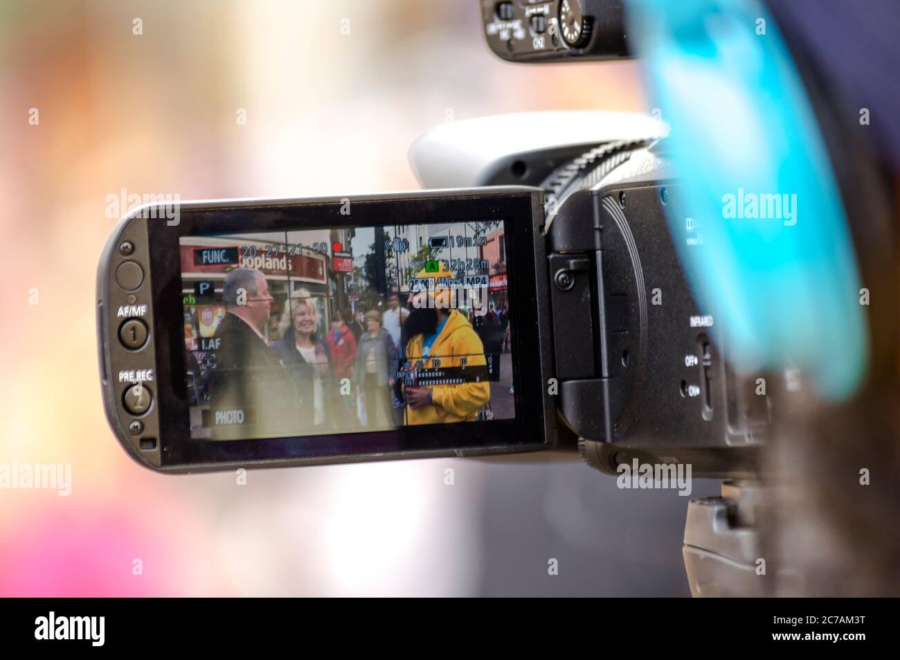 Shot of video camera screen, behind the cameraman head Stock Photo - Alamy