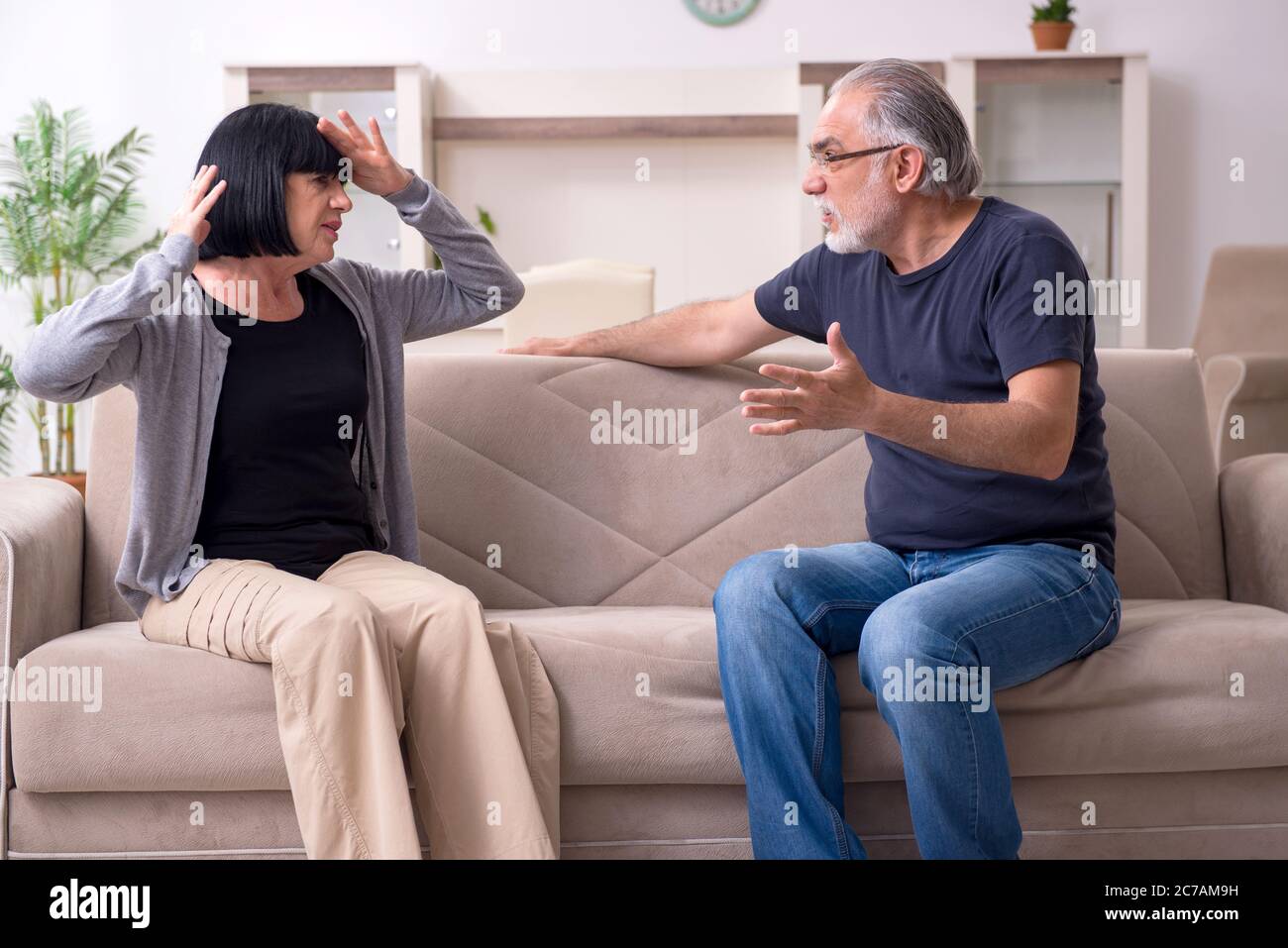 Old couple having argument at the home Stock Photo - Alamy