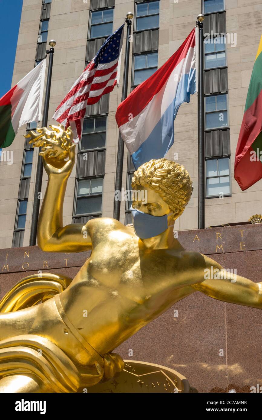 Prometheus in Rockefeller Center features a giant face mask because of ...