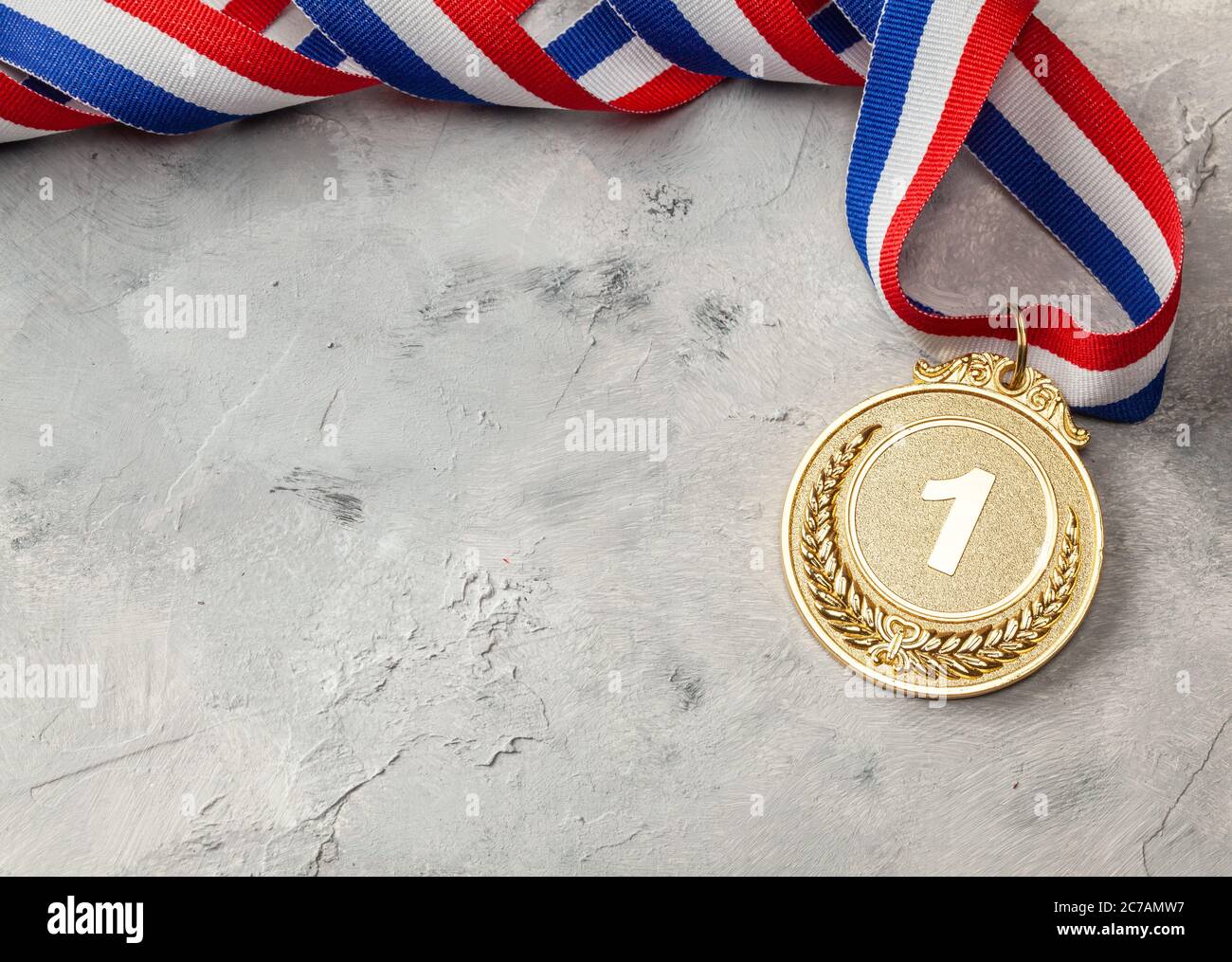 Gold medal. First place award with ribbon Stock Photo - Alamy