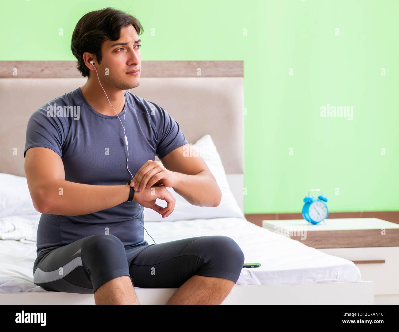 The young handsome man doing morning exercises in the hotel room Stock ...