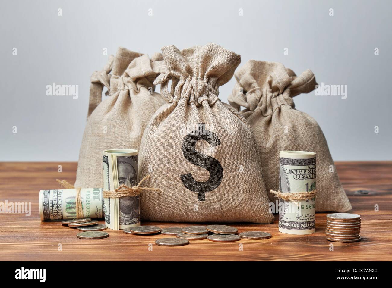 A sack of U.S. dollar bills and money on a white background Stock Photo ...