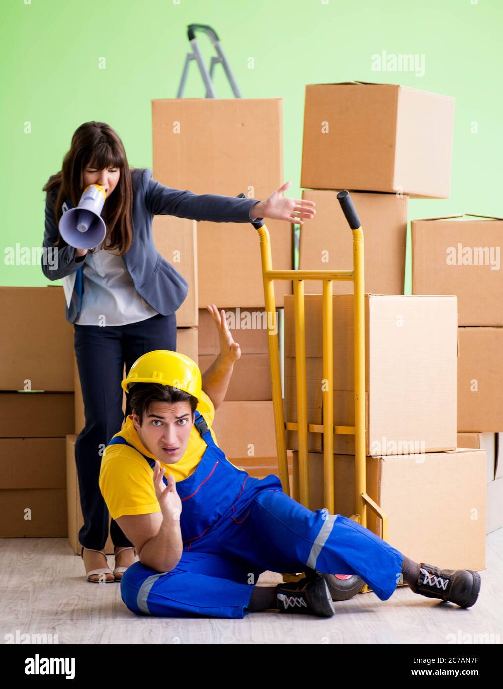 The woman boss and man contractor working with boxes delivery Stock ...